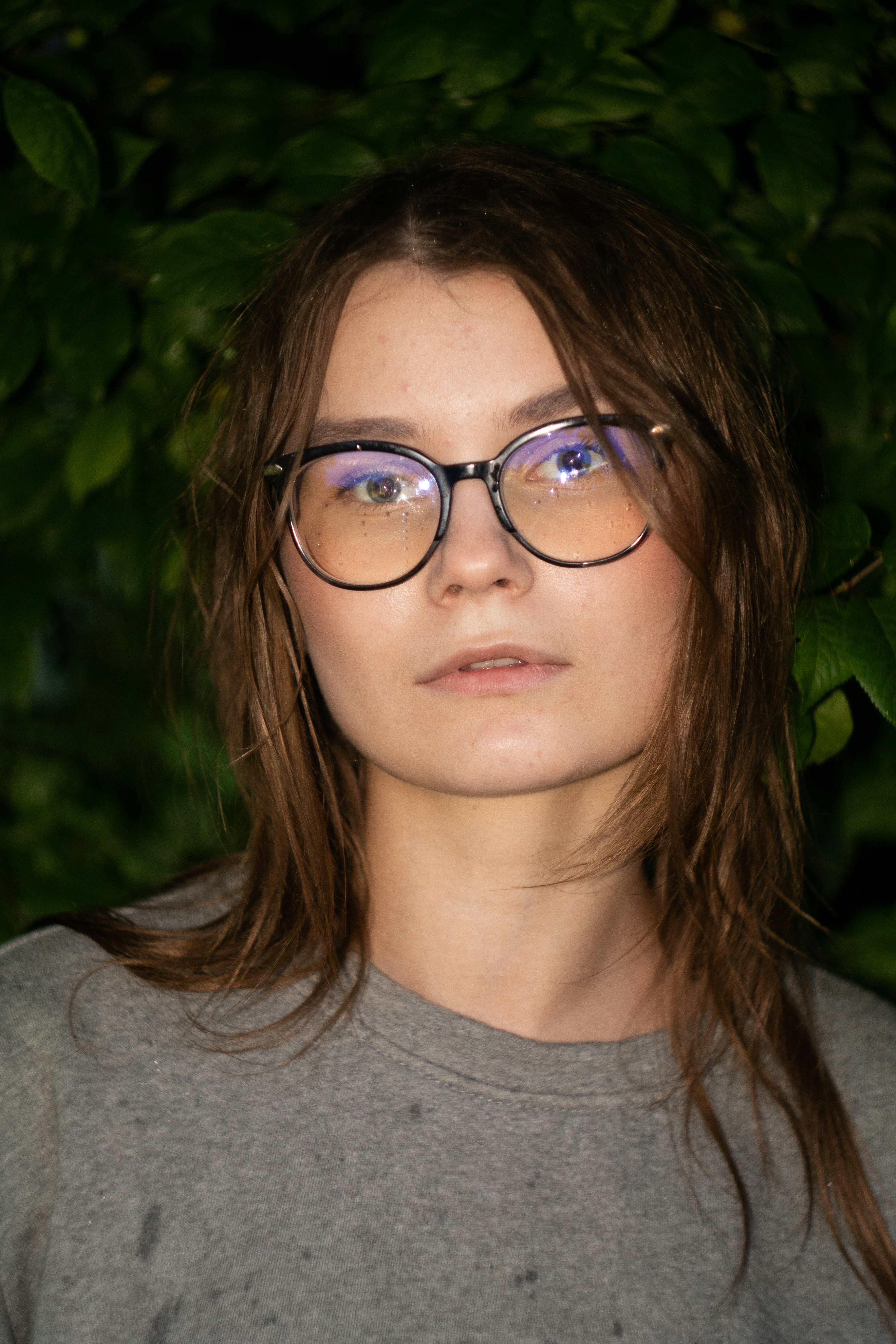 Glasses and Gaze: Portrait in Soft Night Light