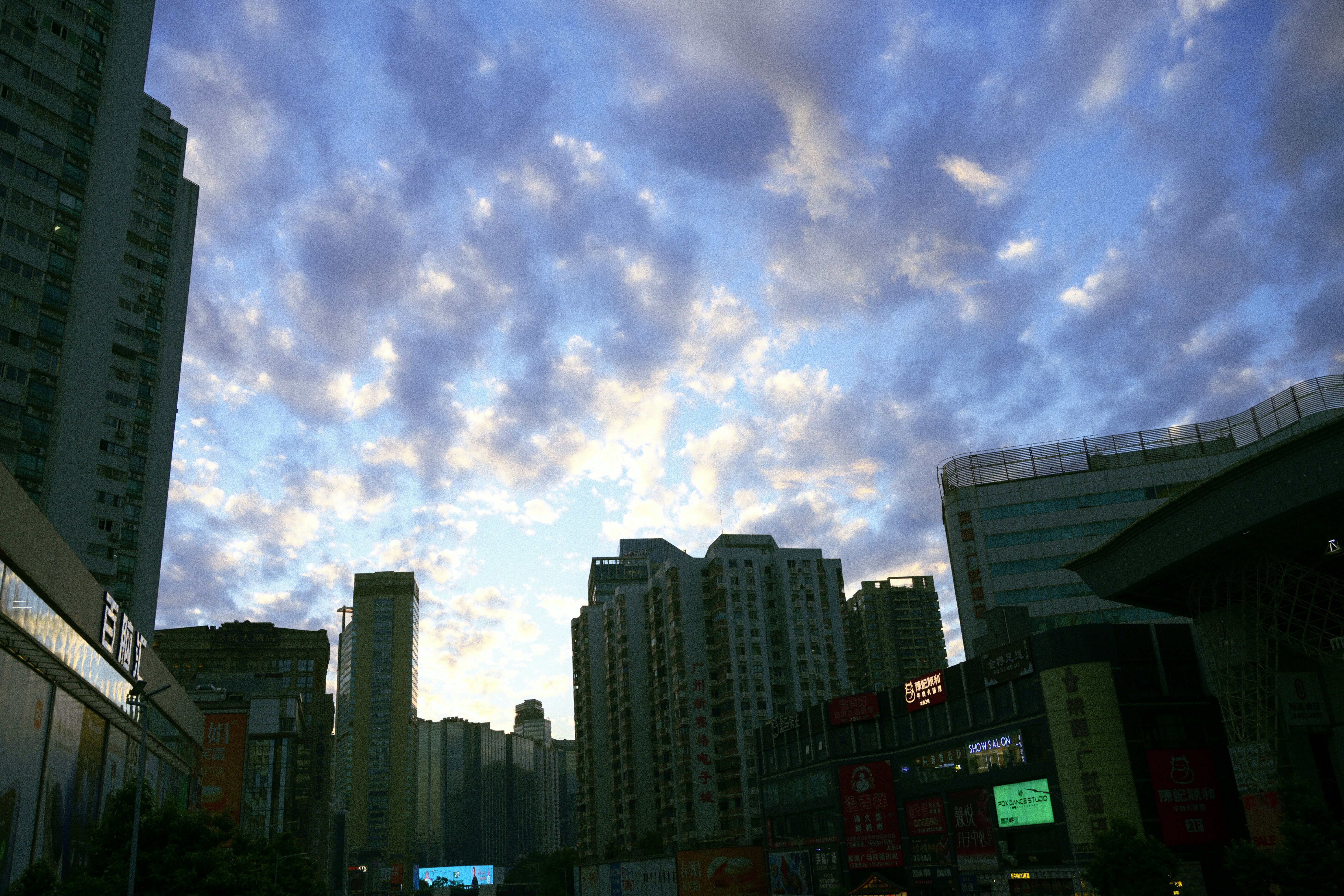 Skyline Echoes: Dusk Light over a Terraced City