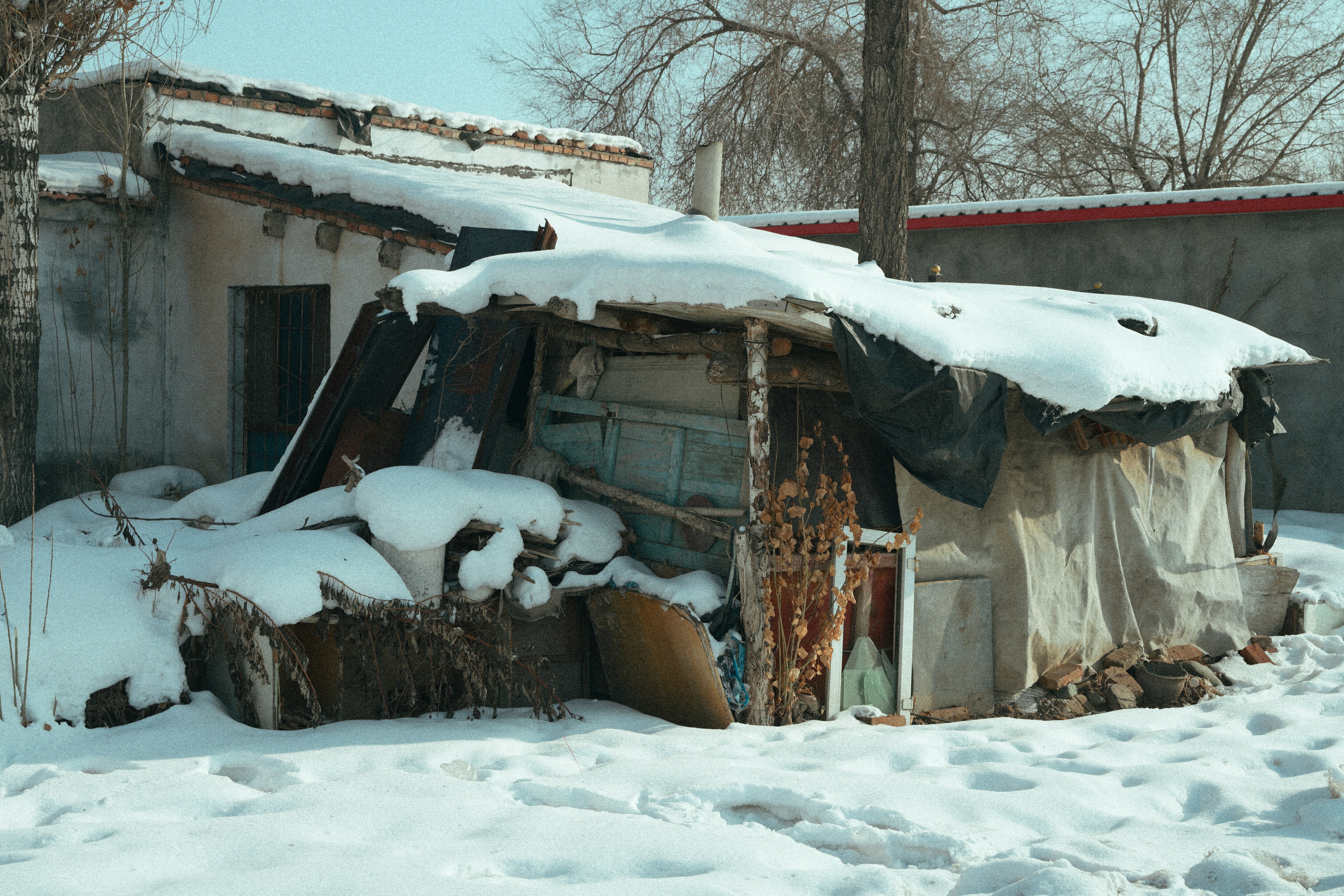 Snow-Capped Shelter: A Crumbling Shack in Quiet Winter Light