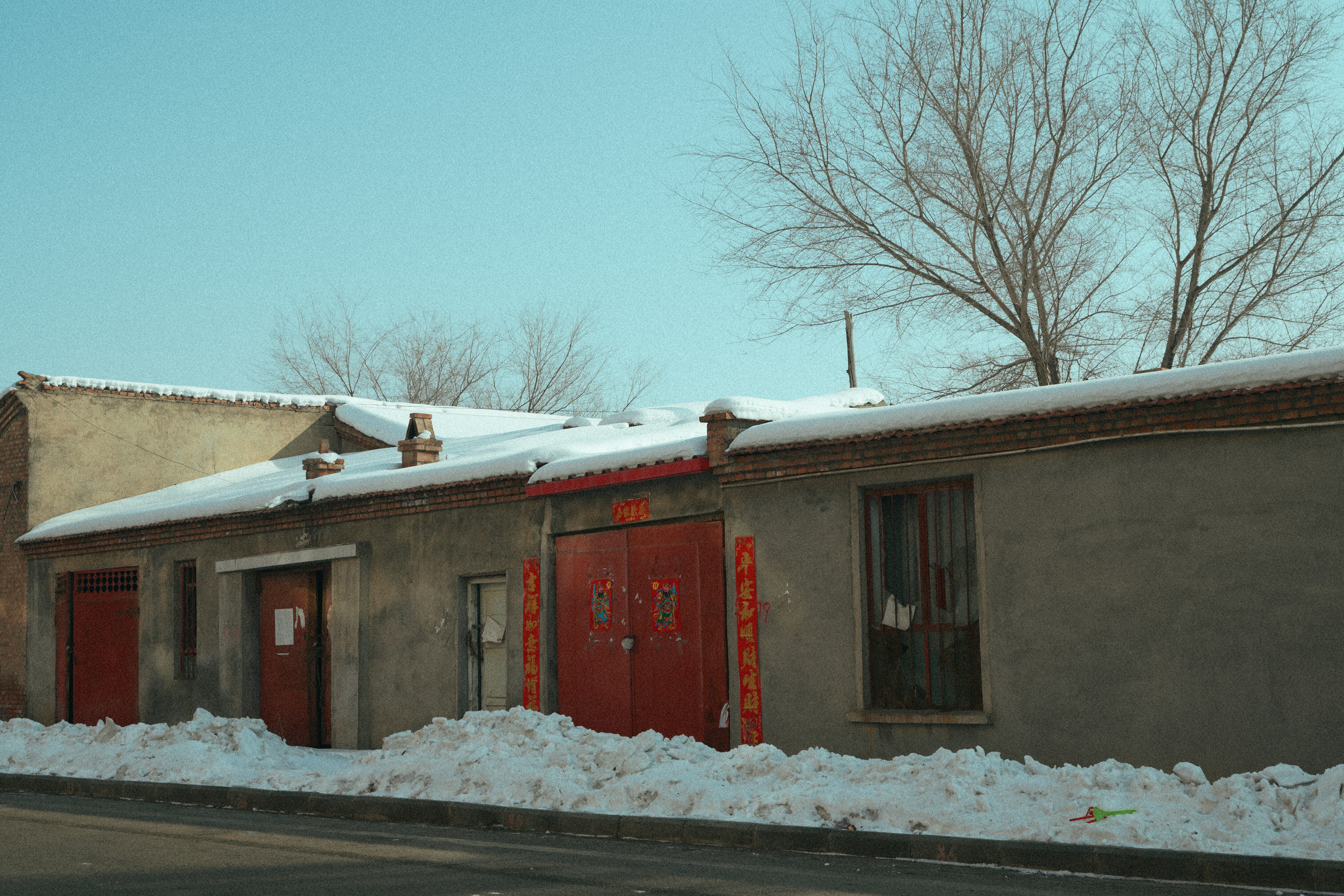 Snow-Cloaked Chinese Courtyard Facade on a Quiet Street
