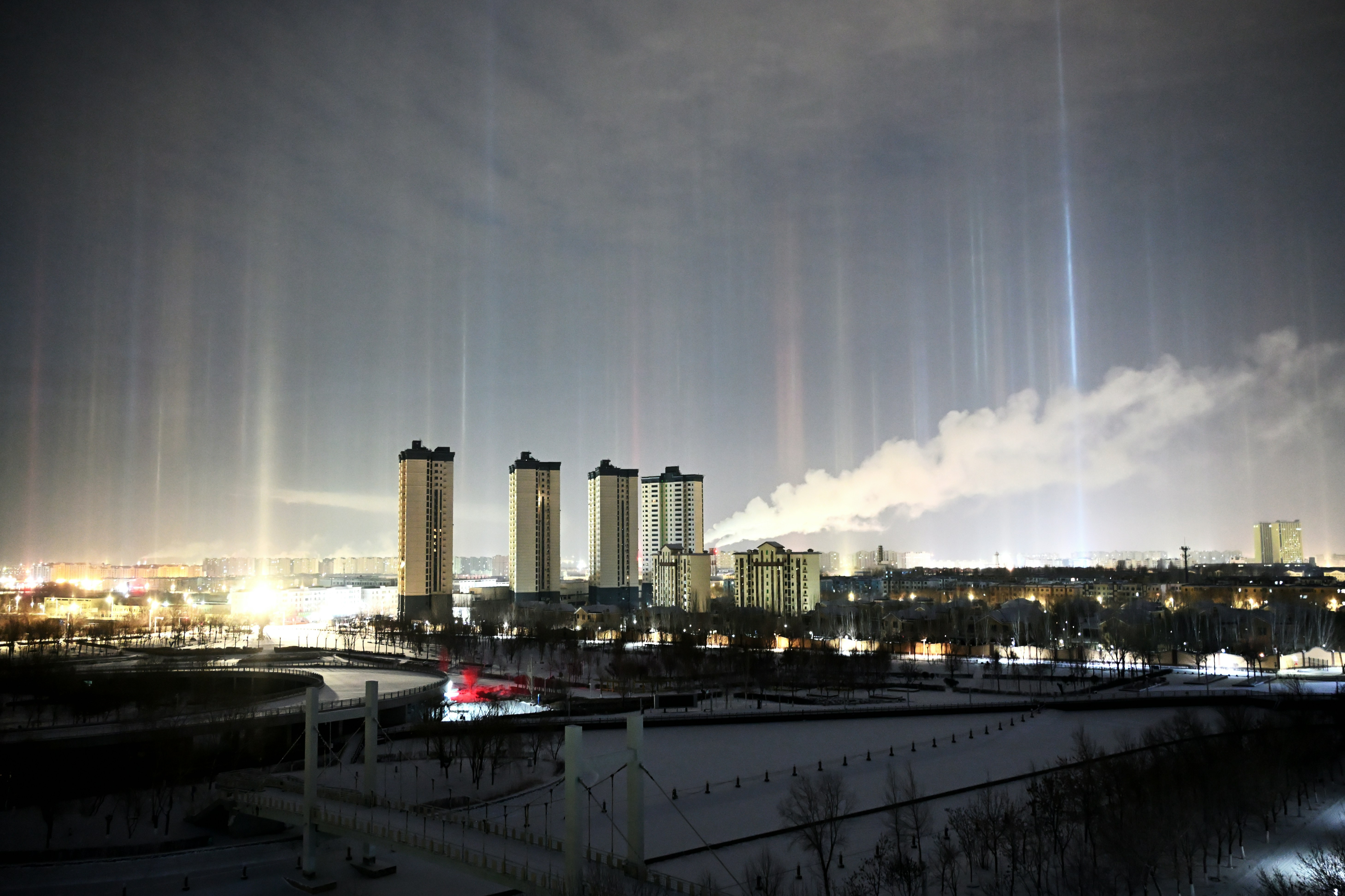 Nightfall Towers: Illuminated Skyline Piercing the Snow