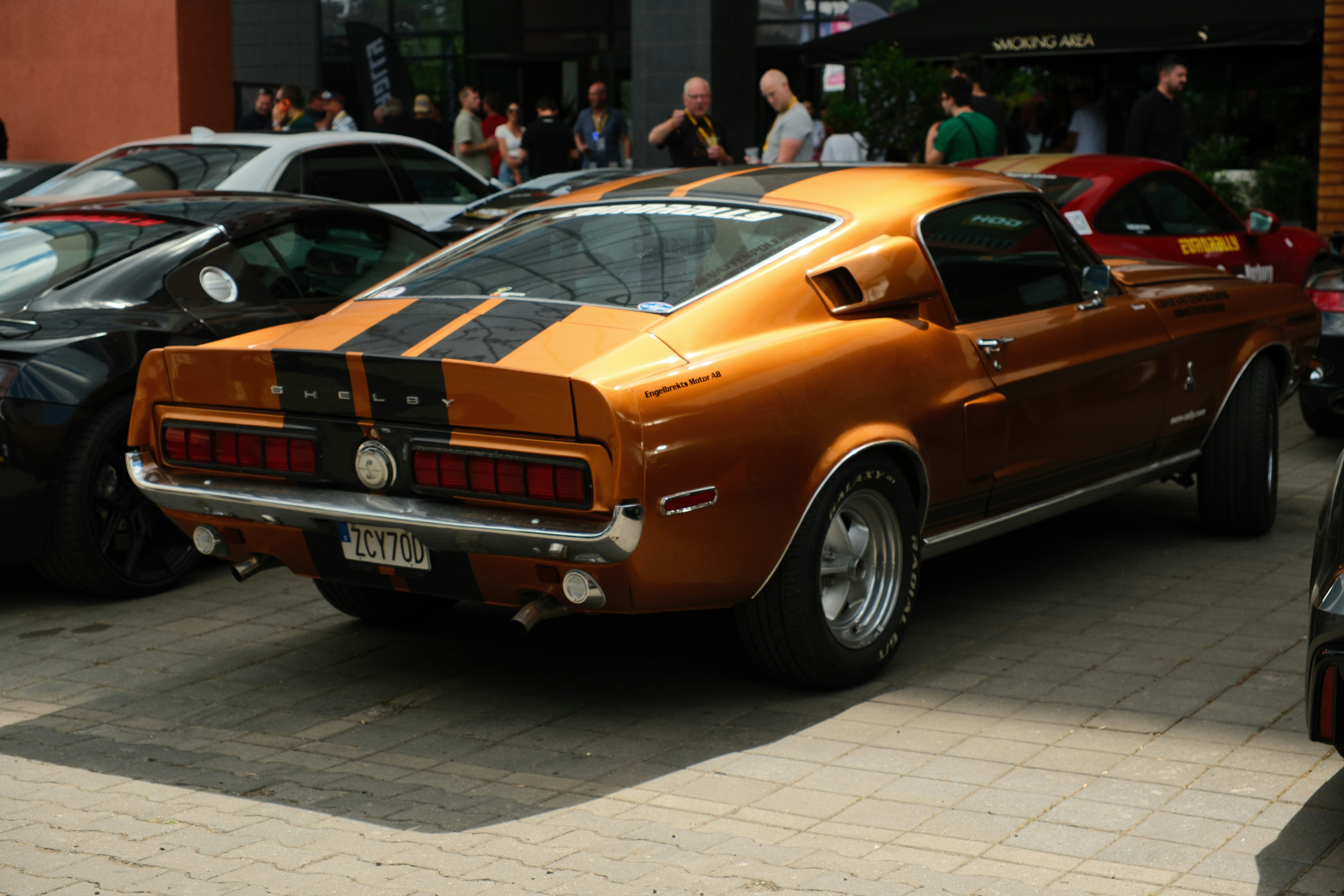 Orange Muscle: A Classic Ford Stands Out at the Car Show