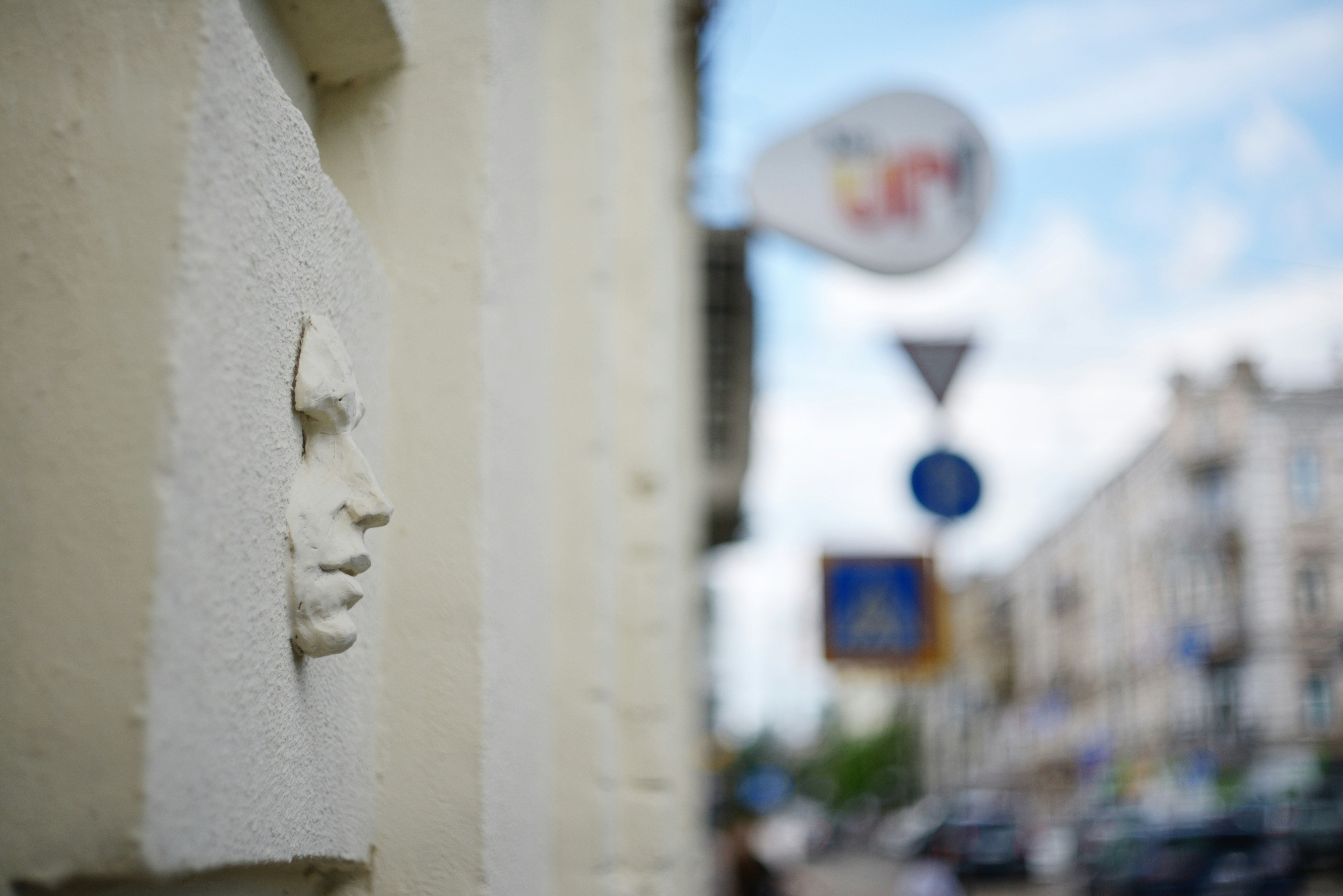 Stone Portrait on a Busy Street