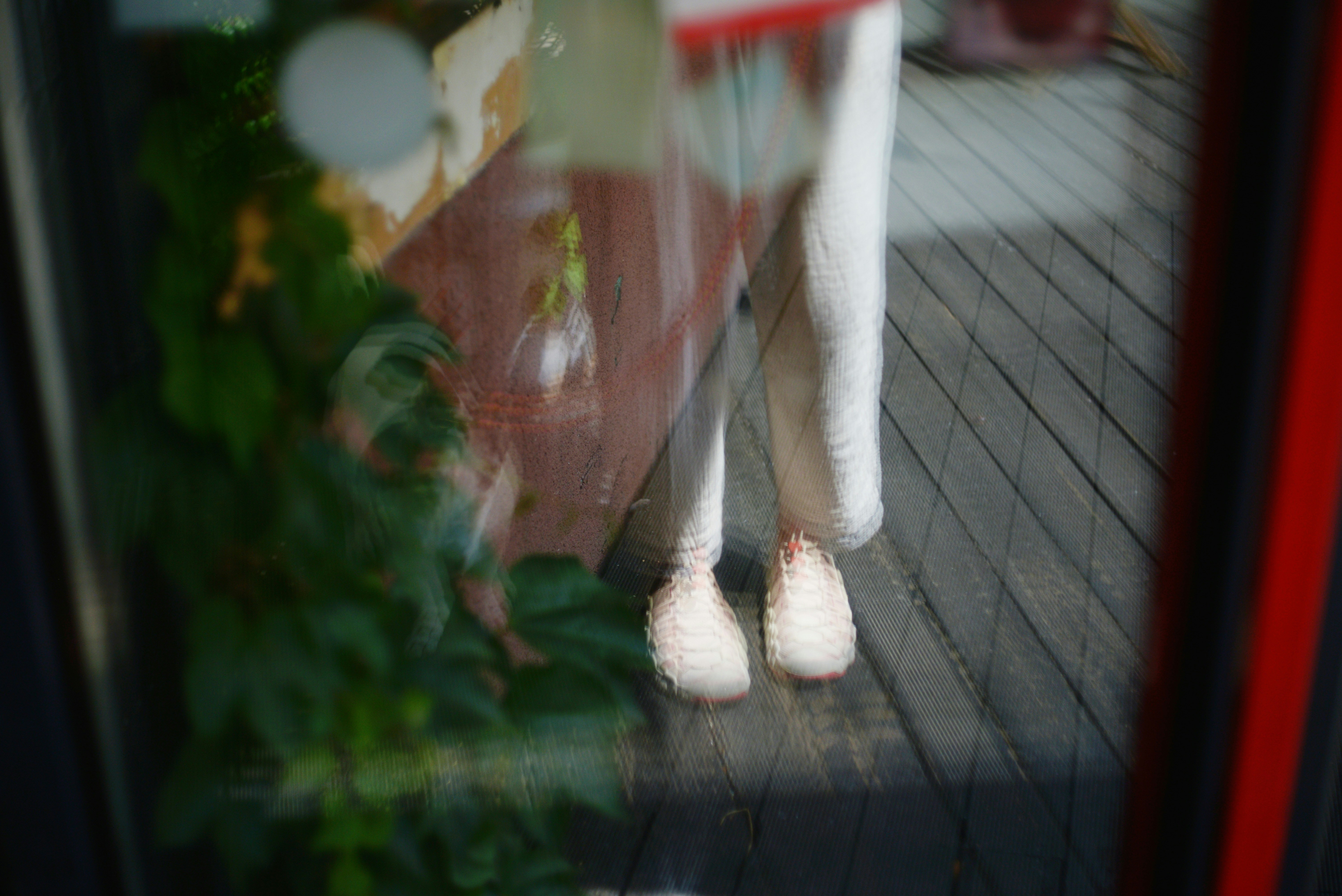 Pastel Shoes in a Glass Window: A Quiet Mirror of Everyday Moments