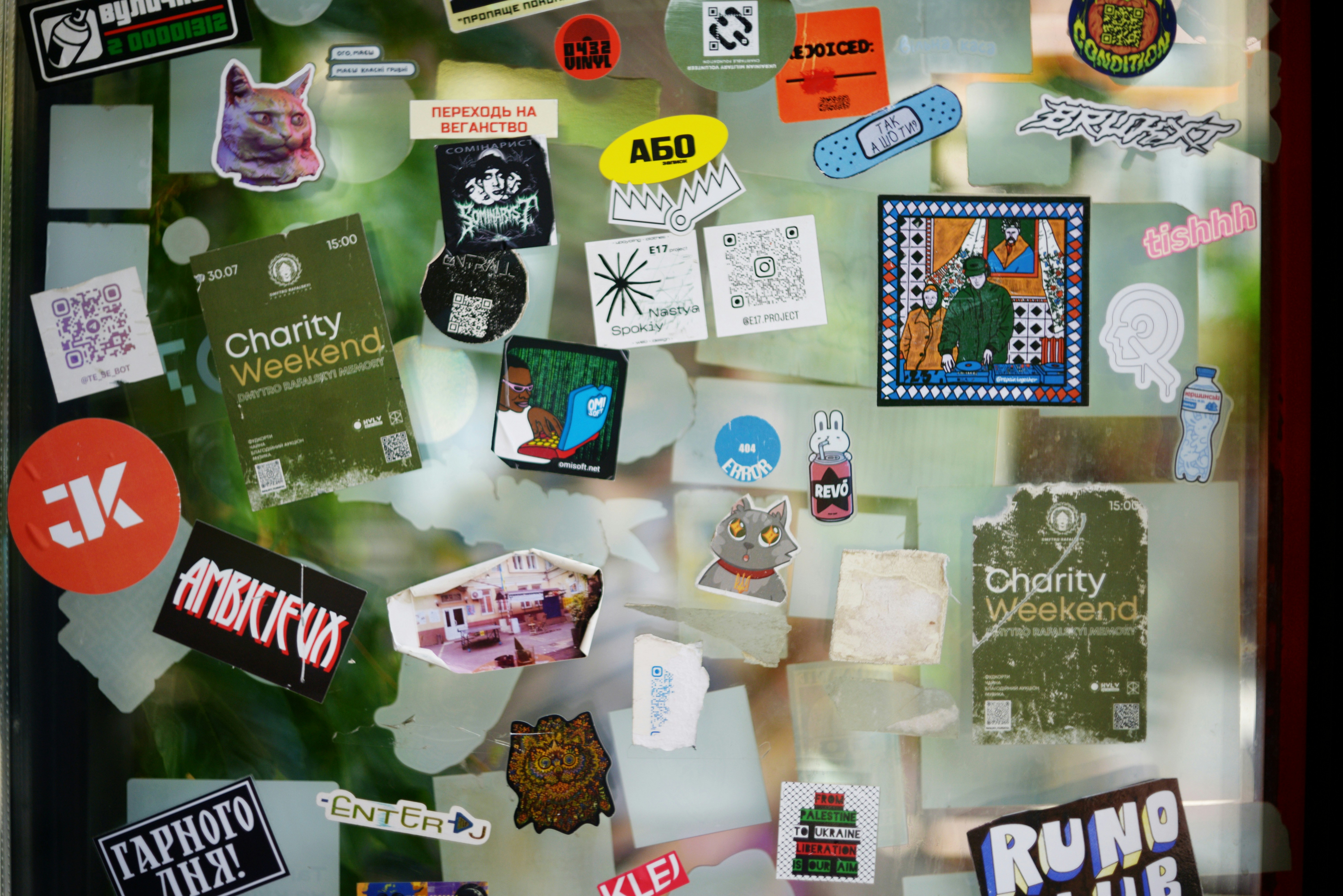 Collage of Street-Style Stickers and Patches with a Noticeably Green Banner