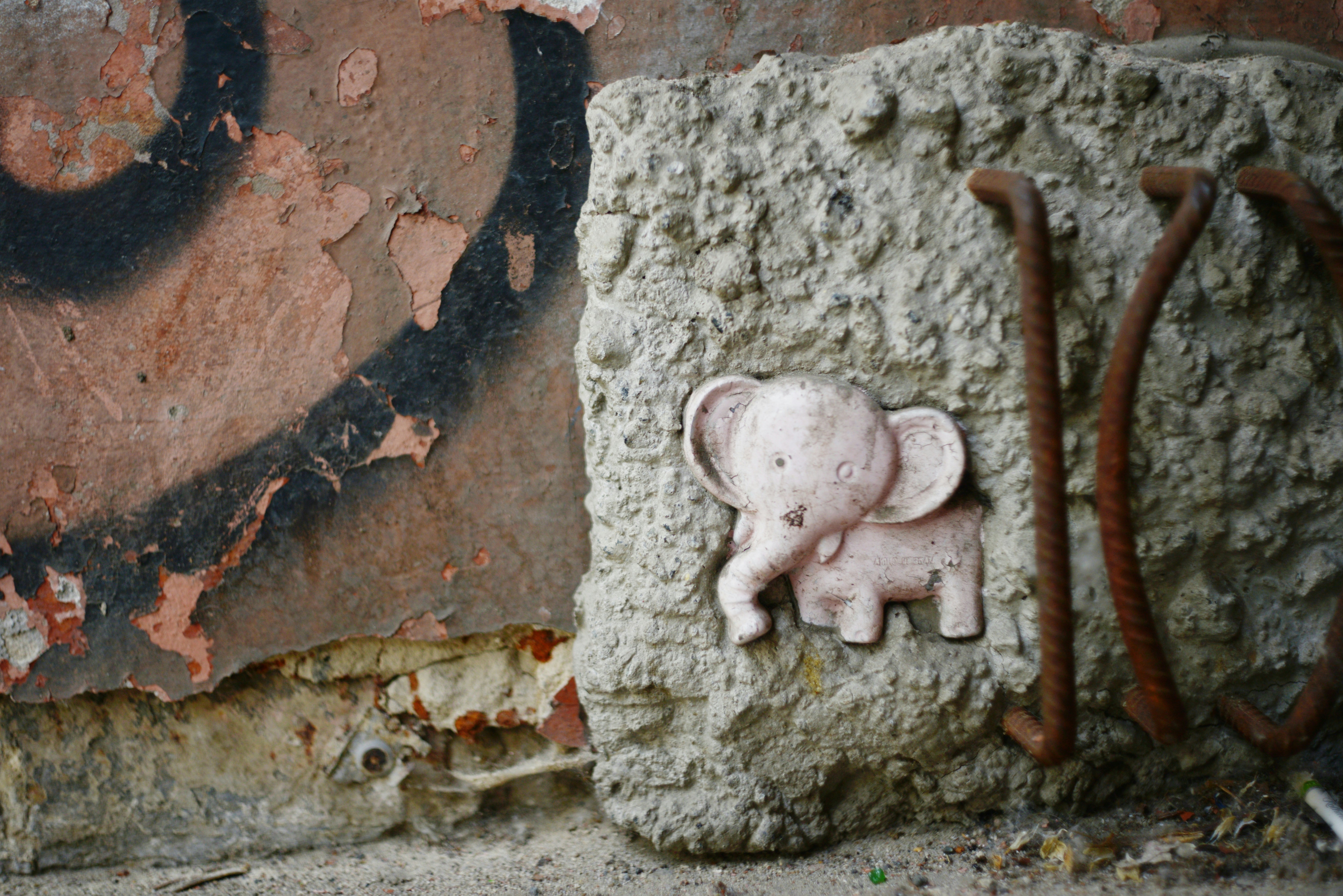 Tiny Pink Elephant Relic Carved in Weathered Concrete