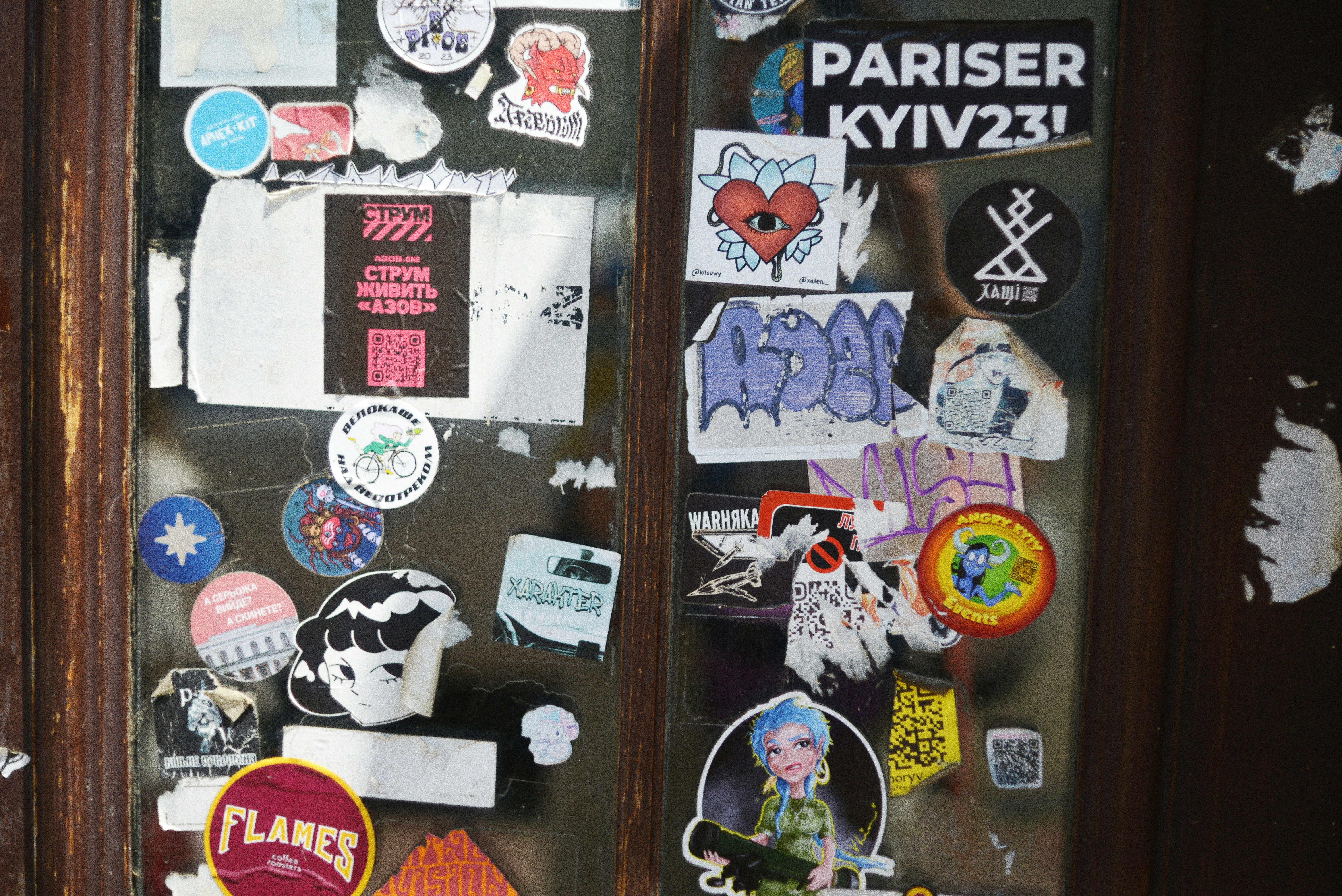 Stickered Doorway: A Patchwork of Urban Signals