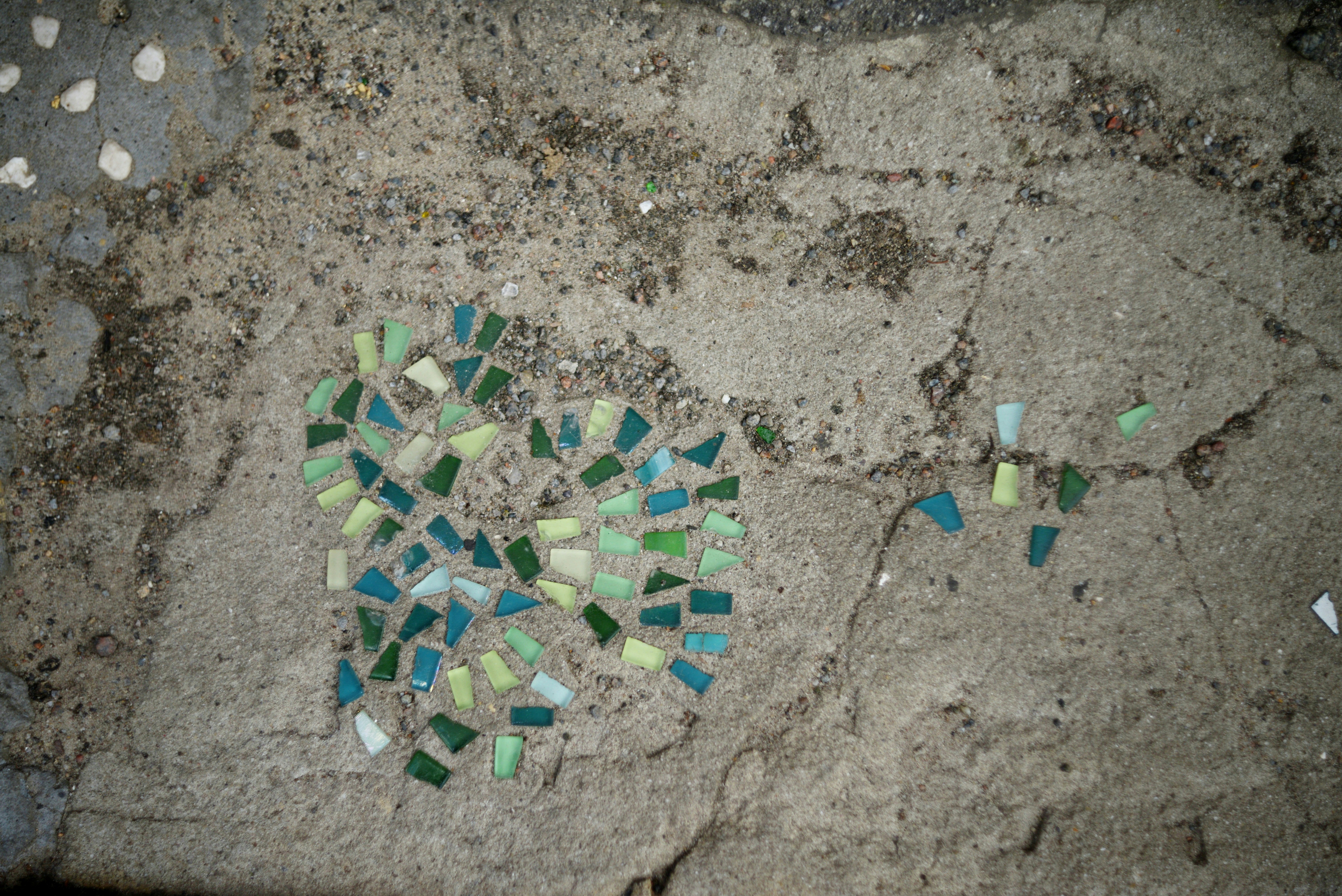 Mosaic Fragments on Weathered Concrete
