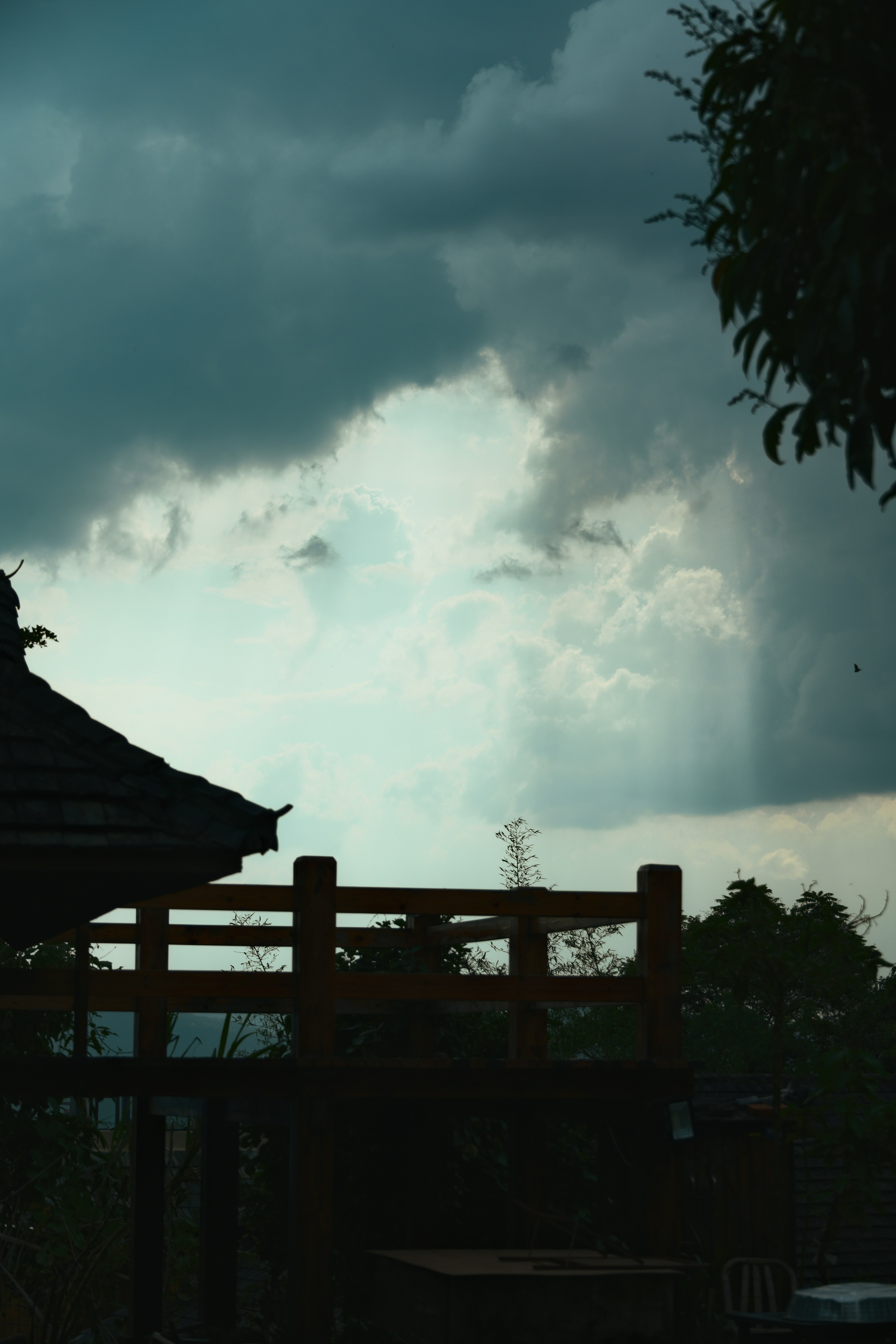 Shadowed Terrace Beneath a Break in the Clouds