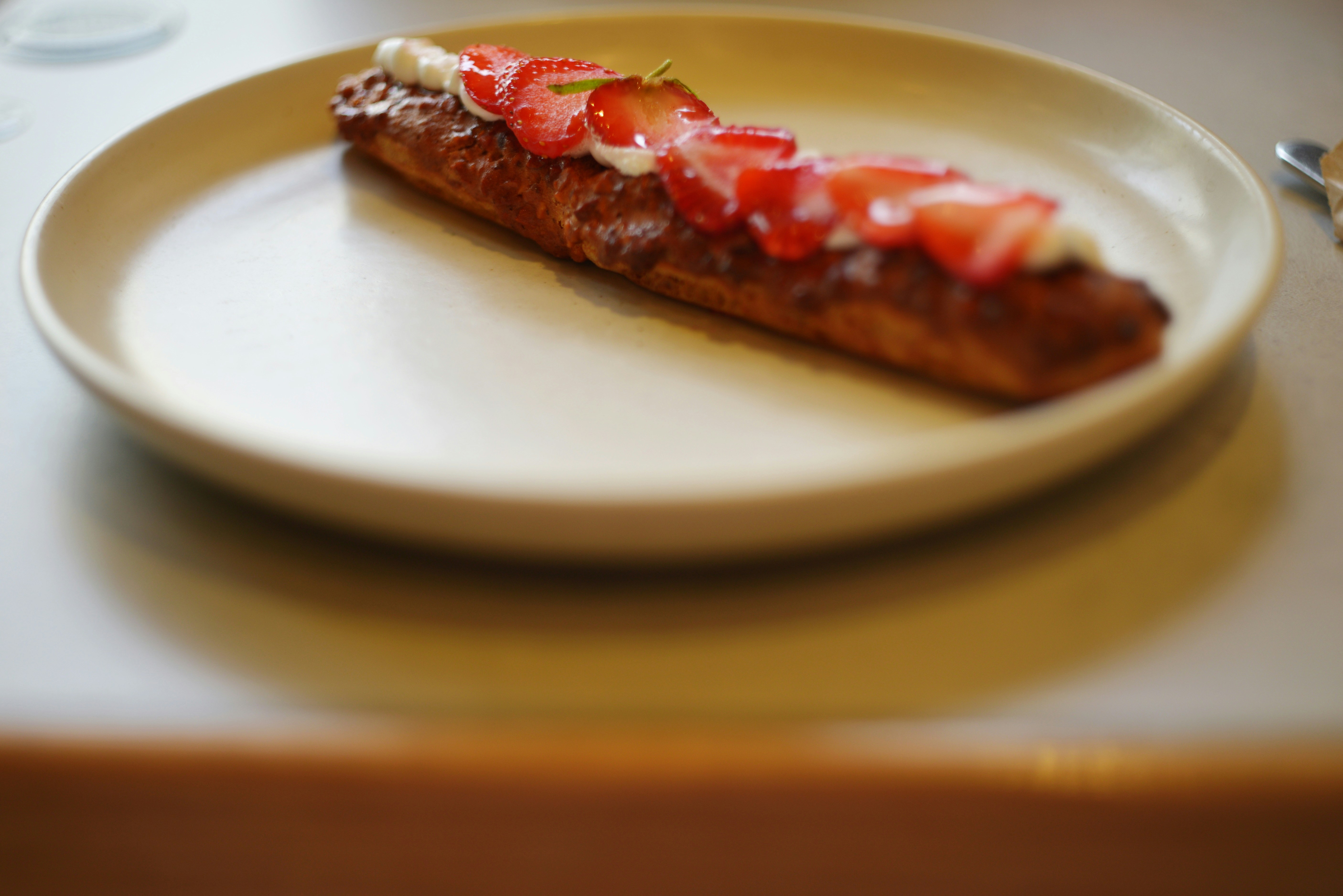 Strawberry-Topped Pastry on a Minimal Plate