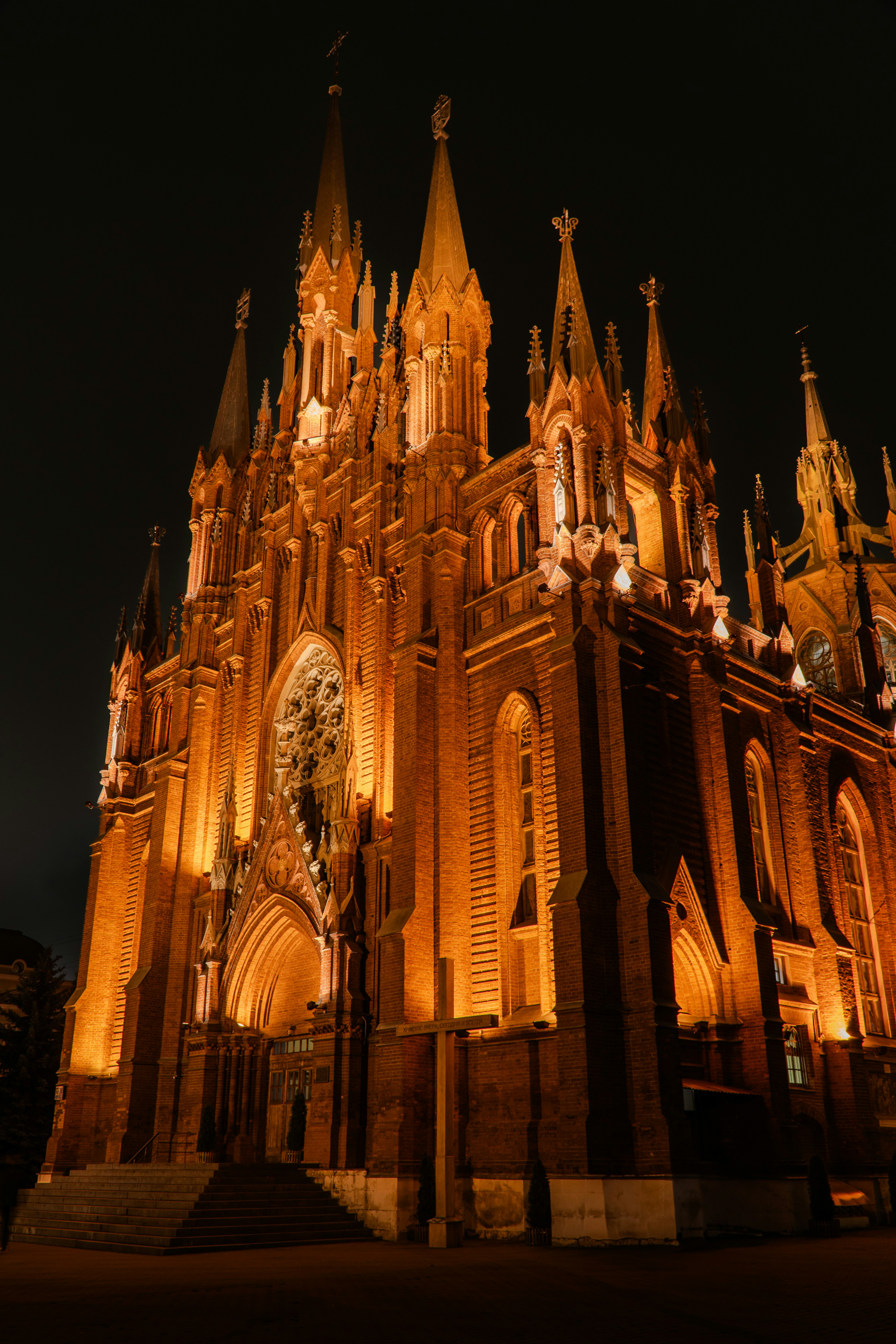 Luminous Gothic Facade: Night-lit Cathedral Rising from the Step Steps