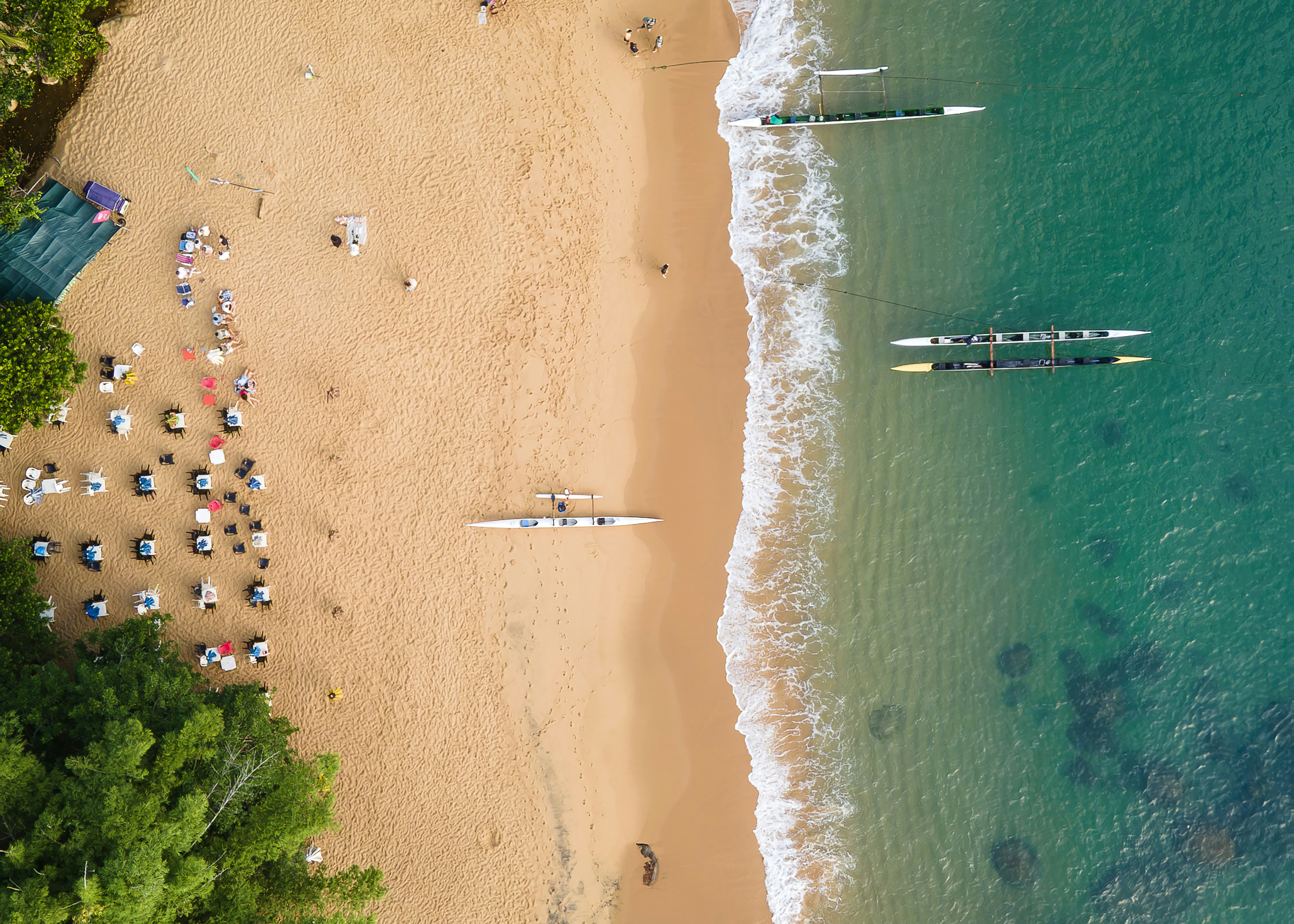 Aerial Breath: Sunlit Beach, Boats and Turquoise Sea