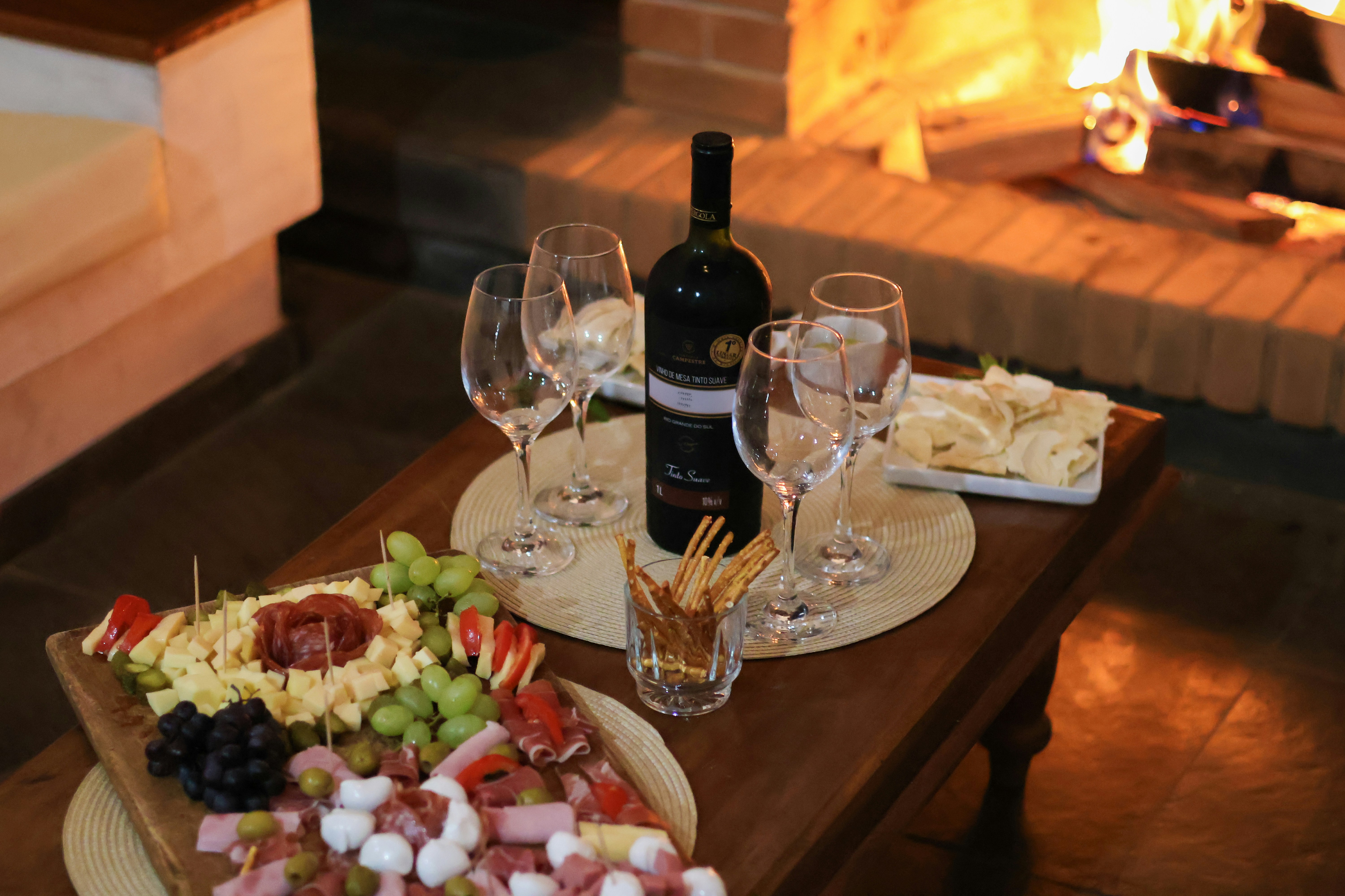 Wine, Cheese, and a Warm Glow by the Fireplace