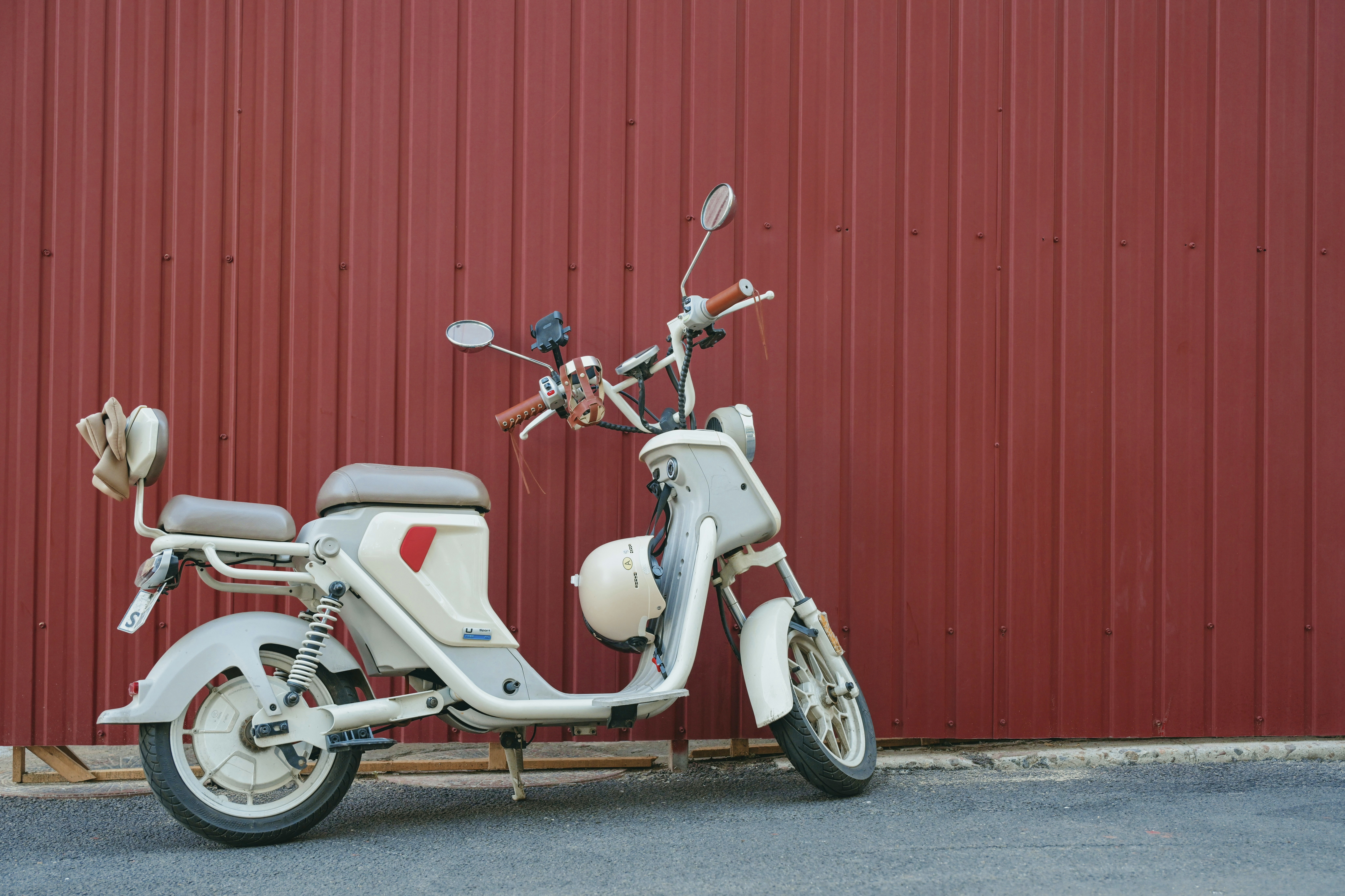 Pastel Scooter by a Red Wall