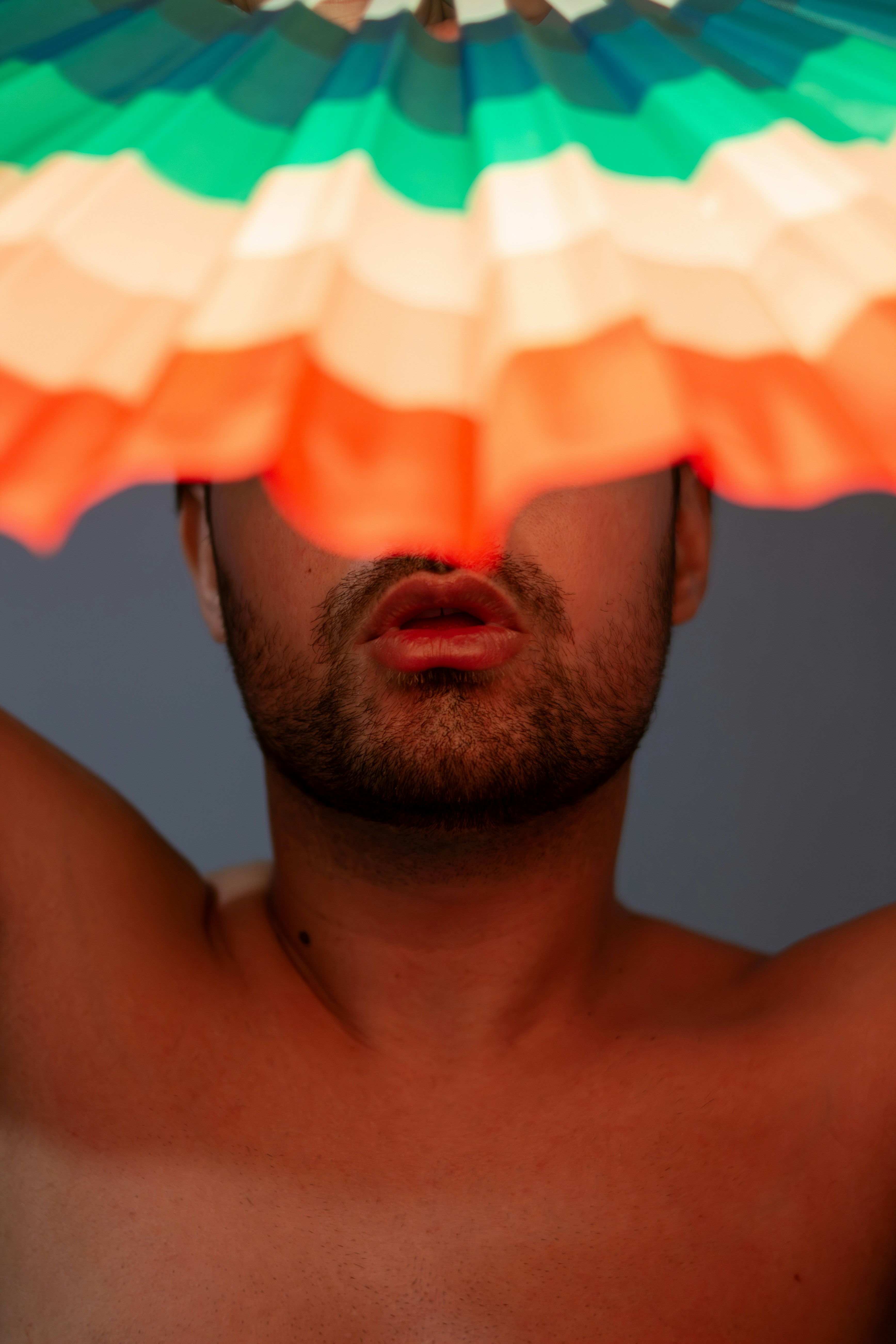 Portrait Under a Rainbow Umbrella: Hidden Mouth, Centered Gaze