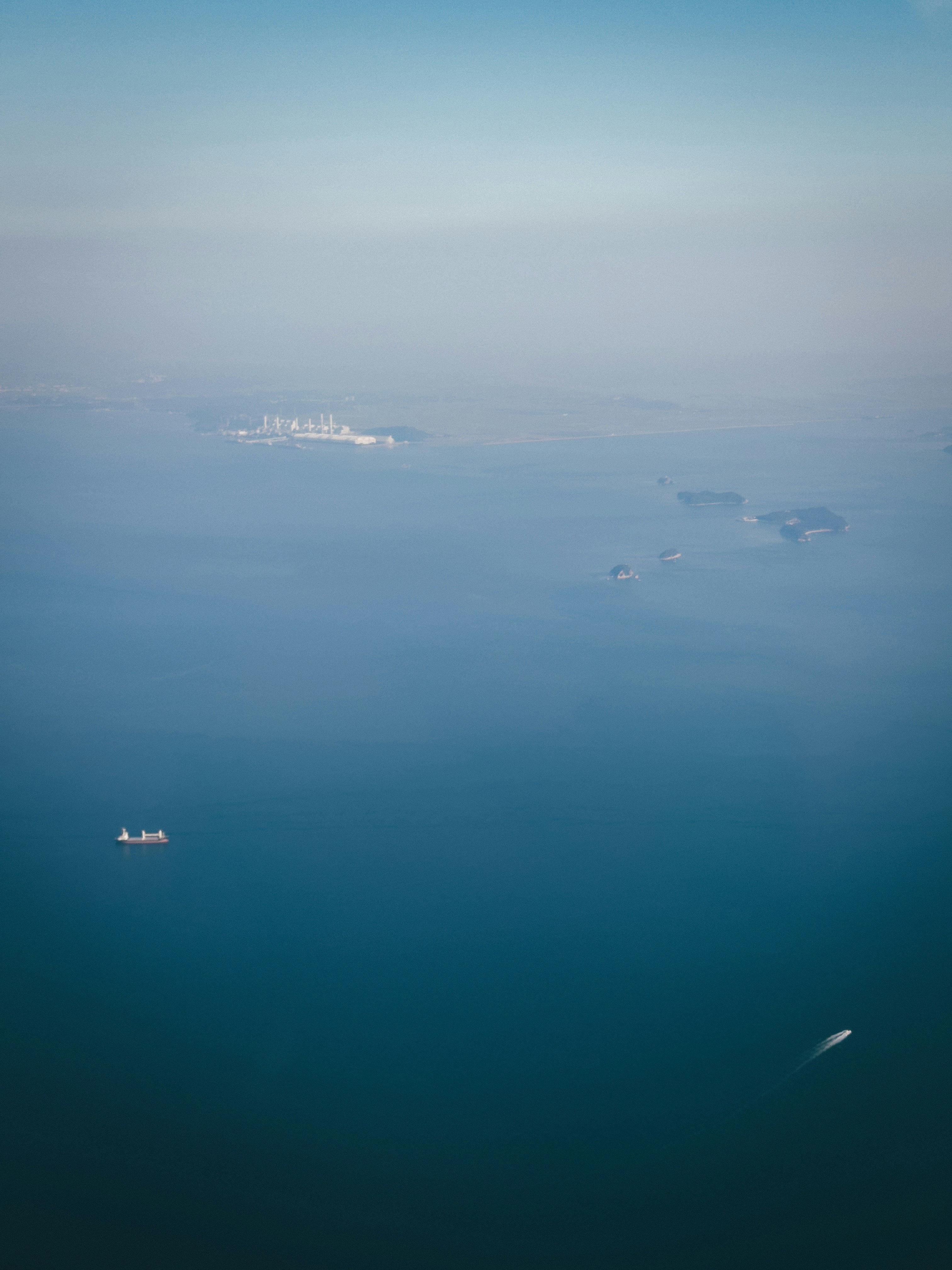 Ships in a Mist: Distant Harbor on a Calm Sea