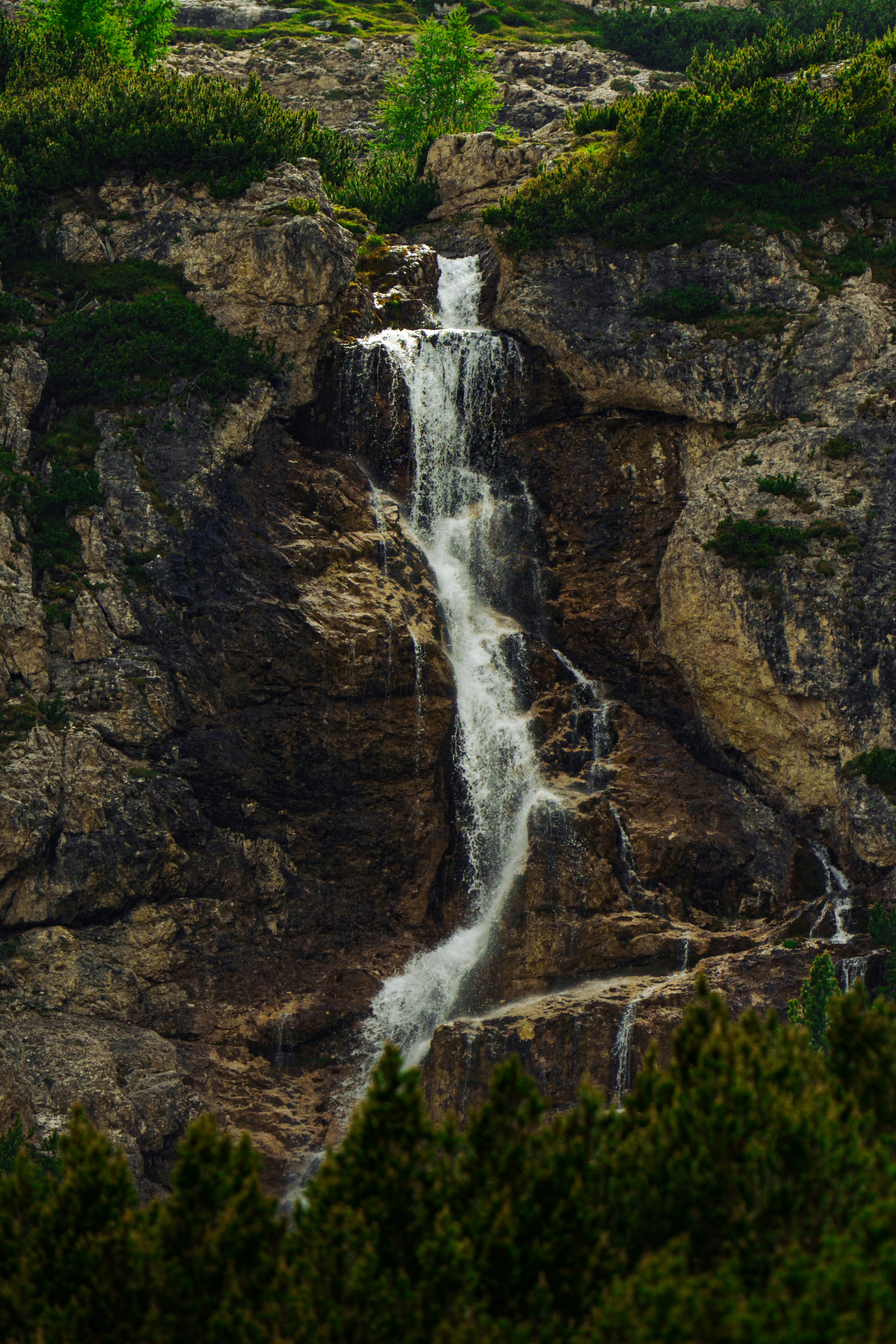 Cascade Through Granite: A Lone Waterfall Carving Quiet Veins in Stone
