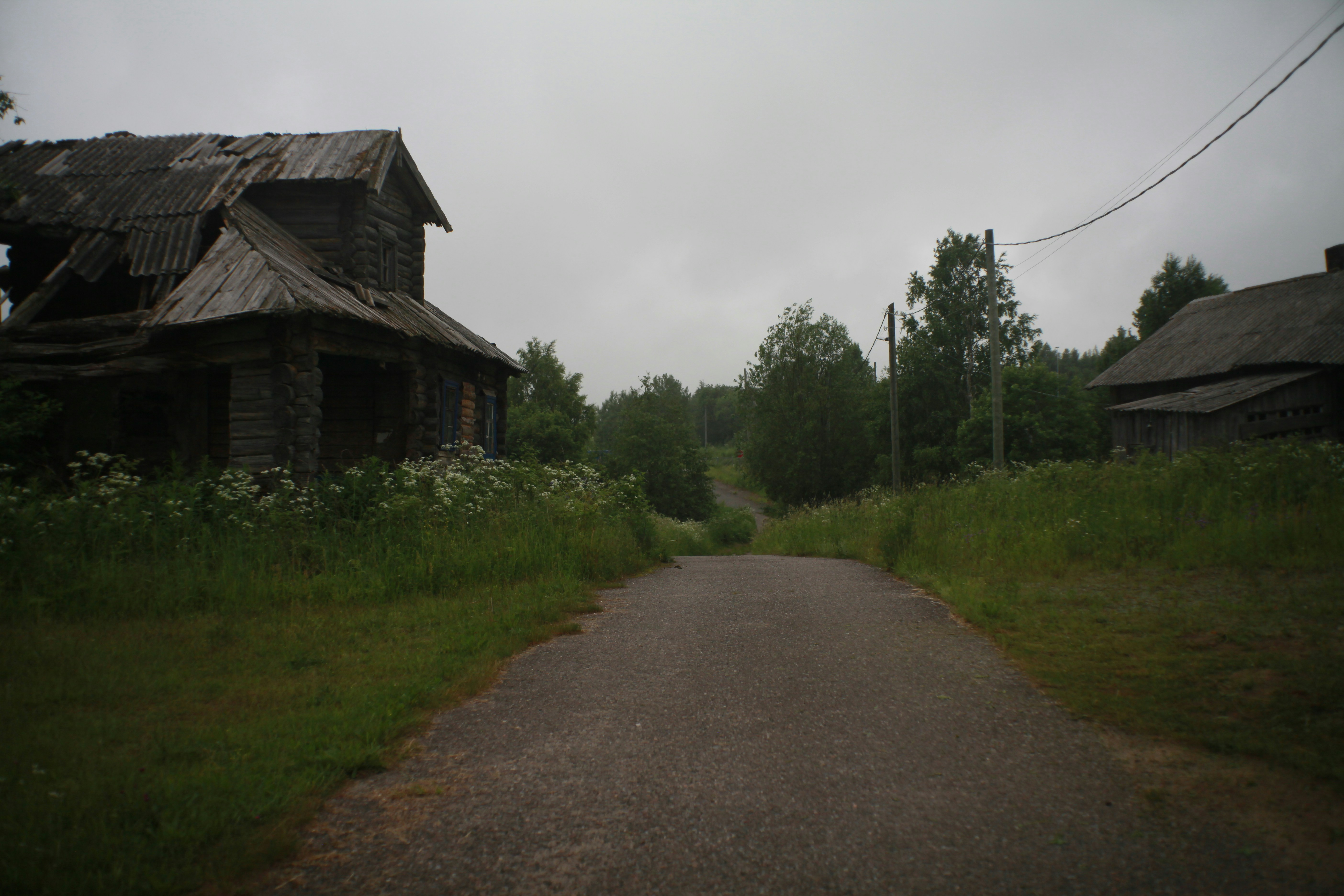 Deserted Lane Between Weathered Cottages