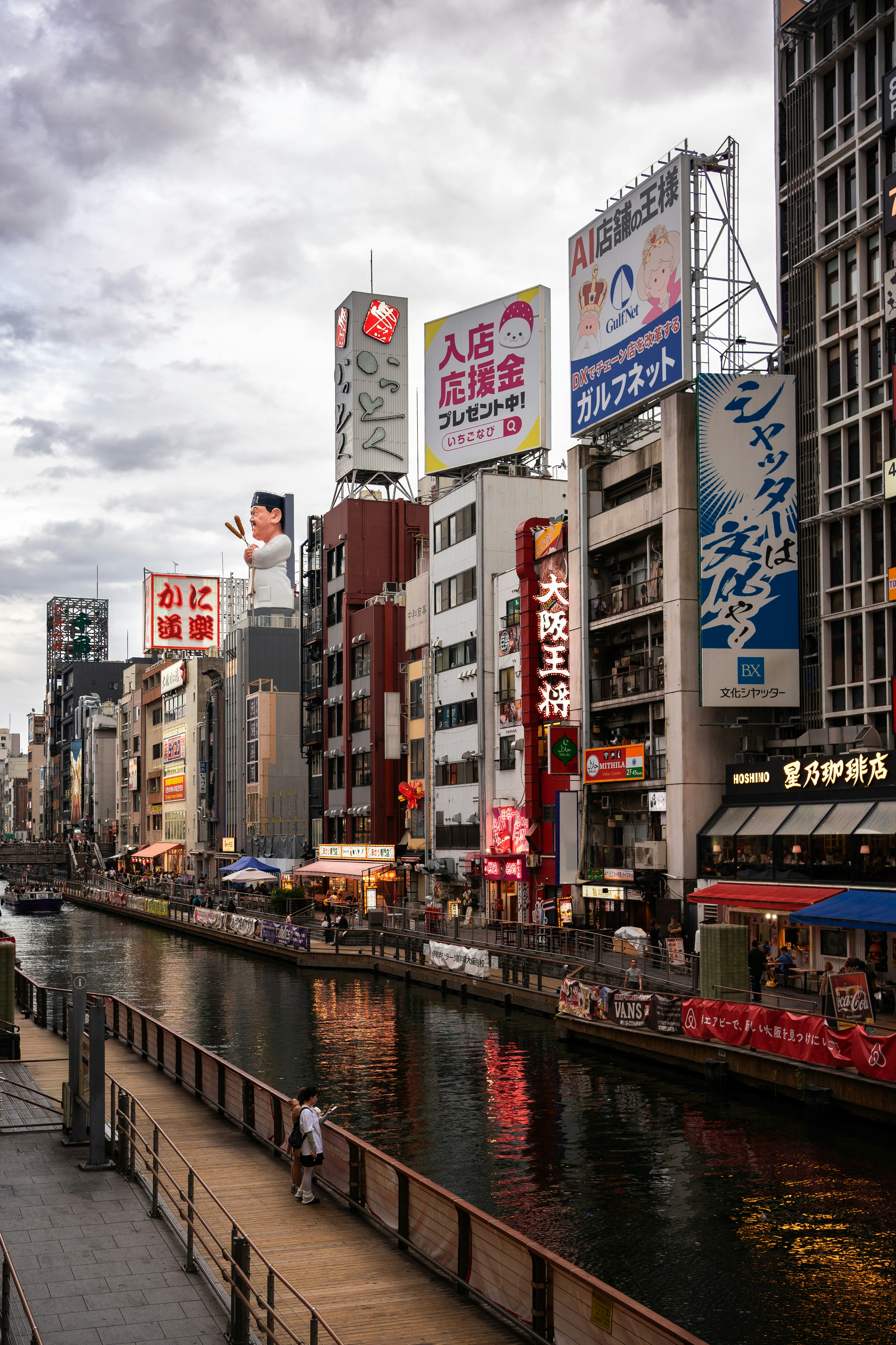 Neon Riverfront: A City Canal Bathed in Evening Light