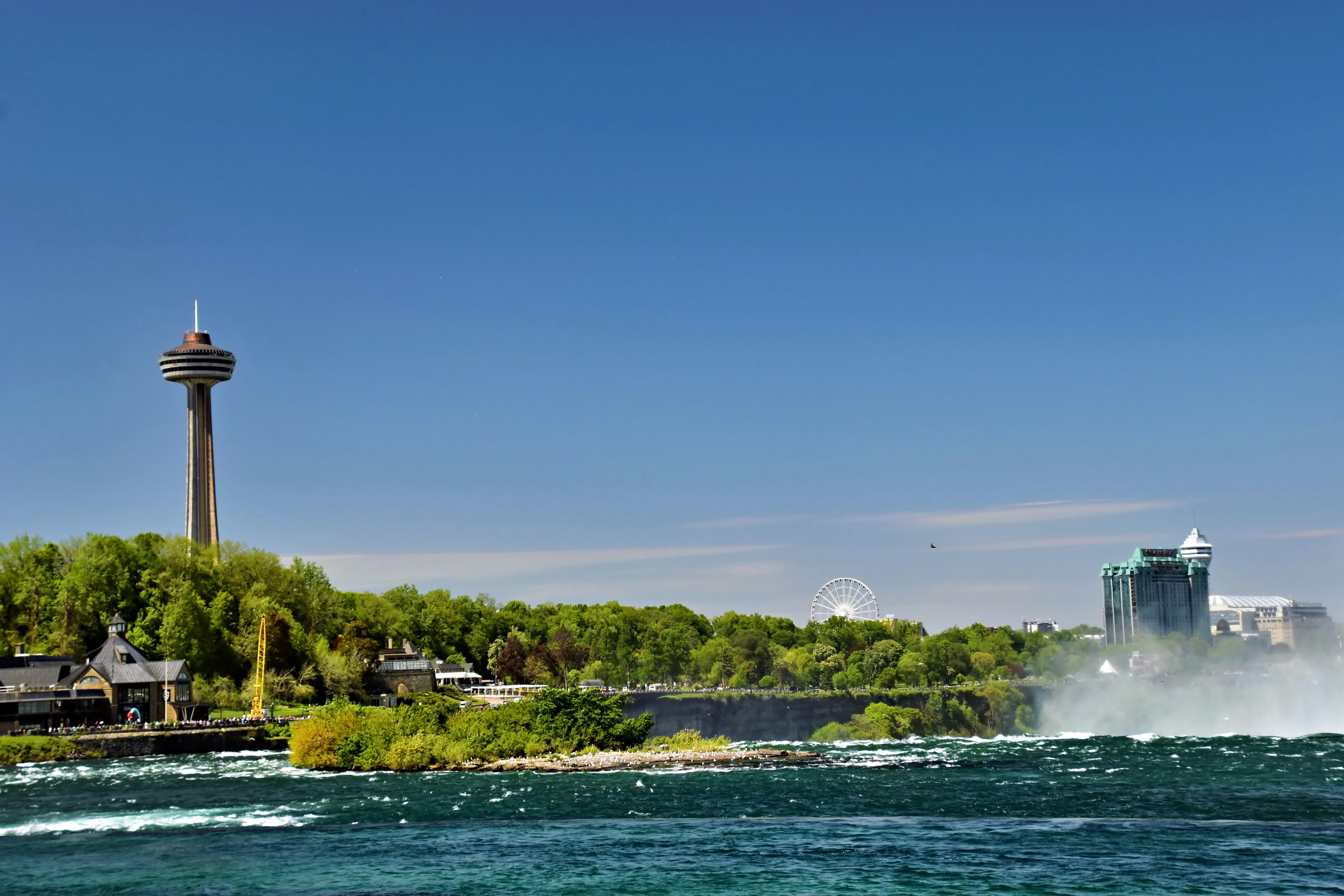 Terrace of the Waterfront: Lone Tower Overlooking a Green Arc