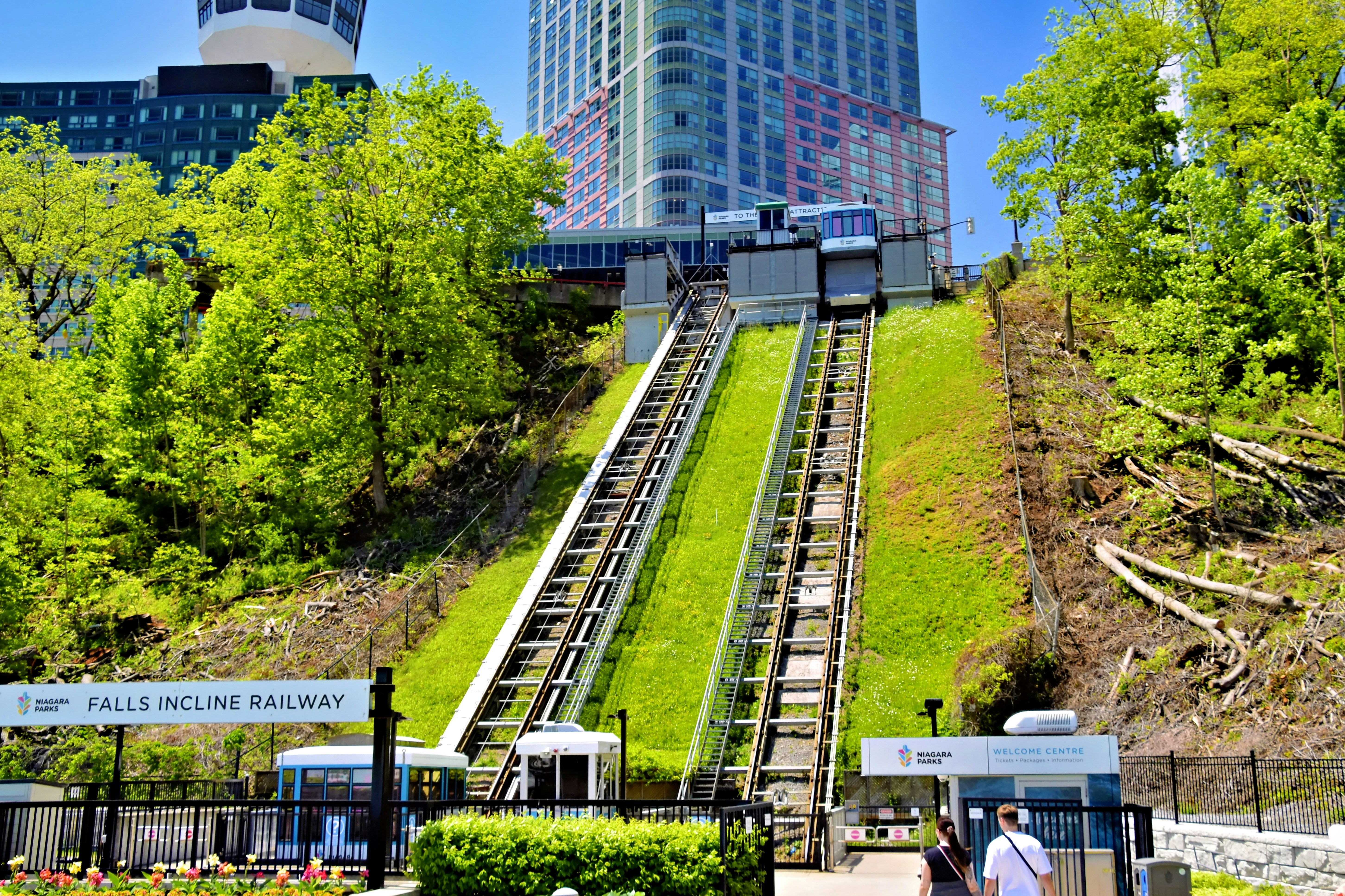 City-side Funicular Descent: A Green-Gold Ramp meeting Urban Towers