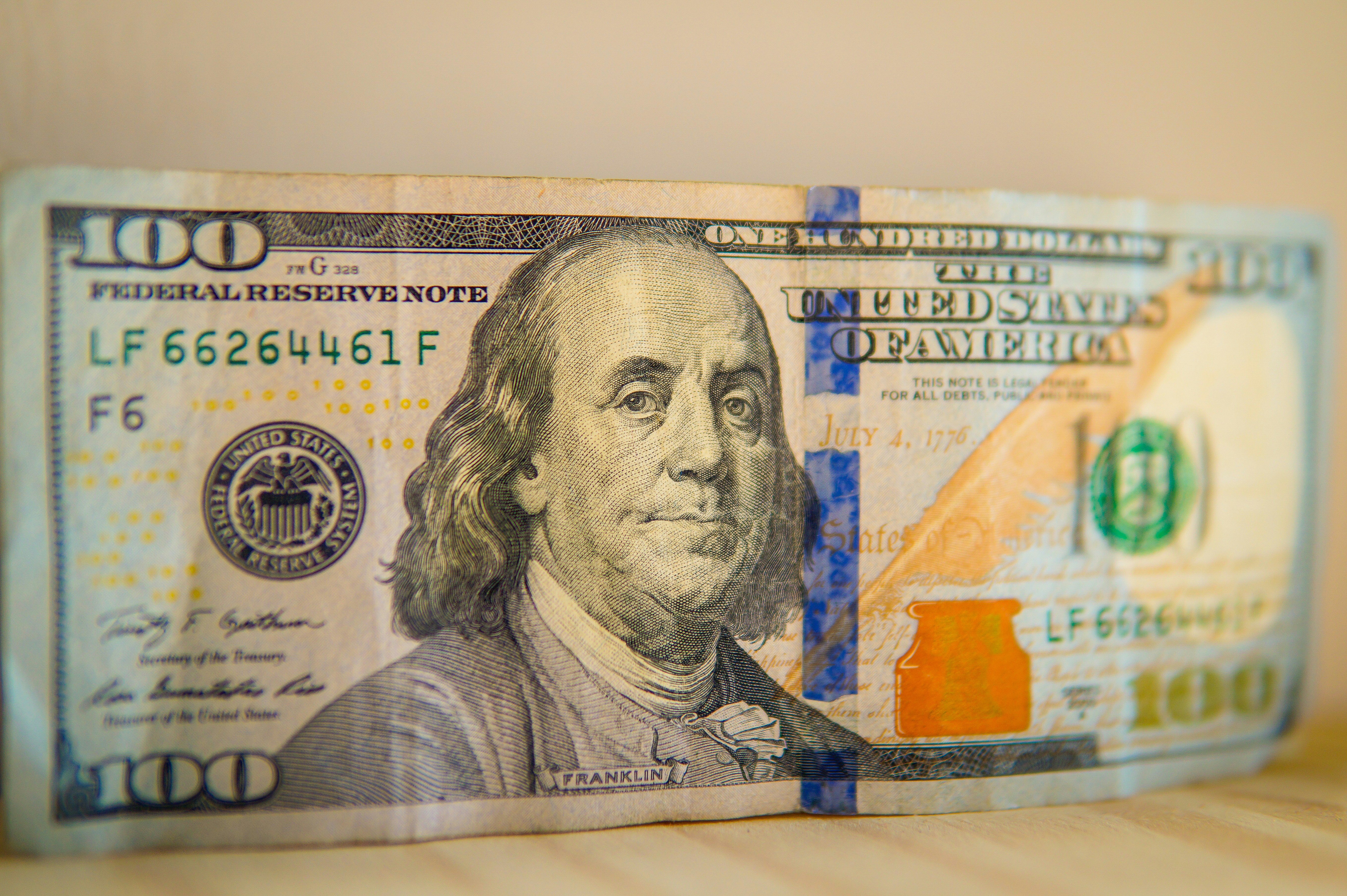 Portrait of a One-Hundred Dollar Portrait: A Close-Up of a Folded Bill's Face