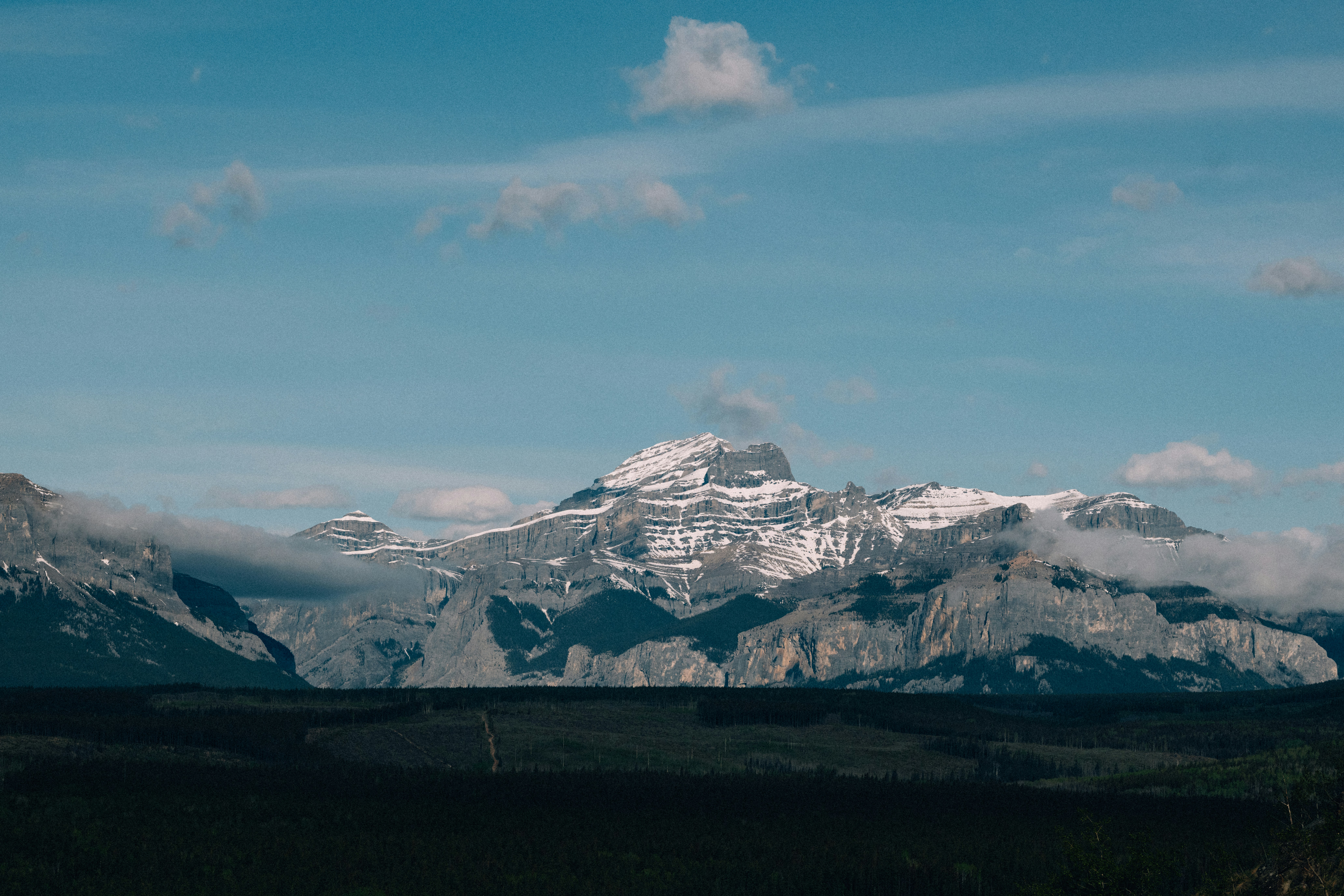 Snowbound Peaks beneath a Clear Arc of Sky