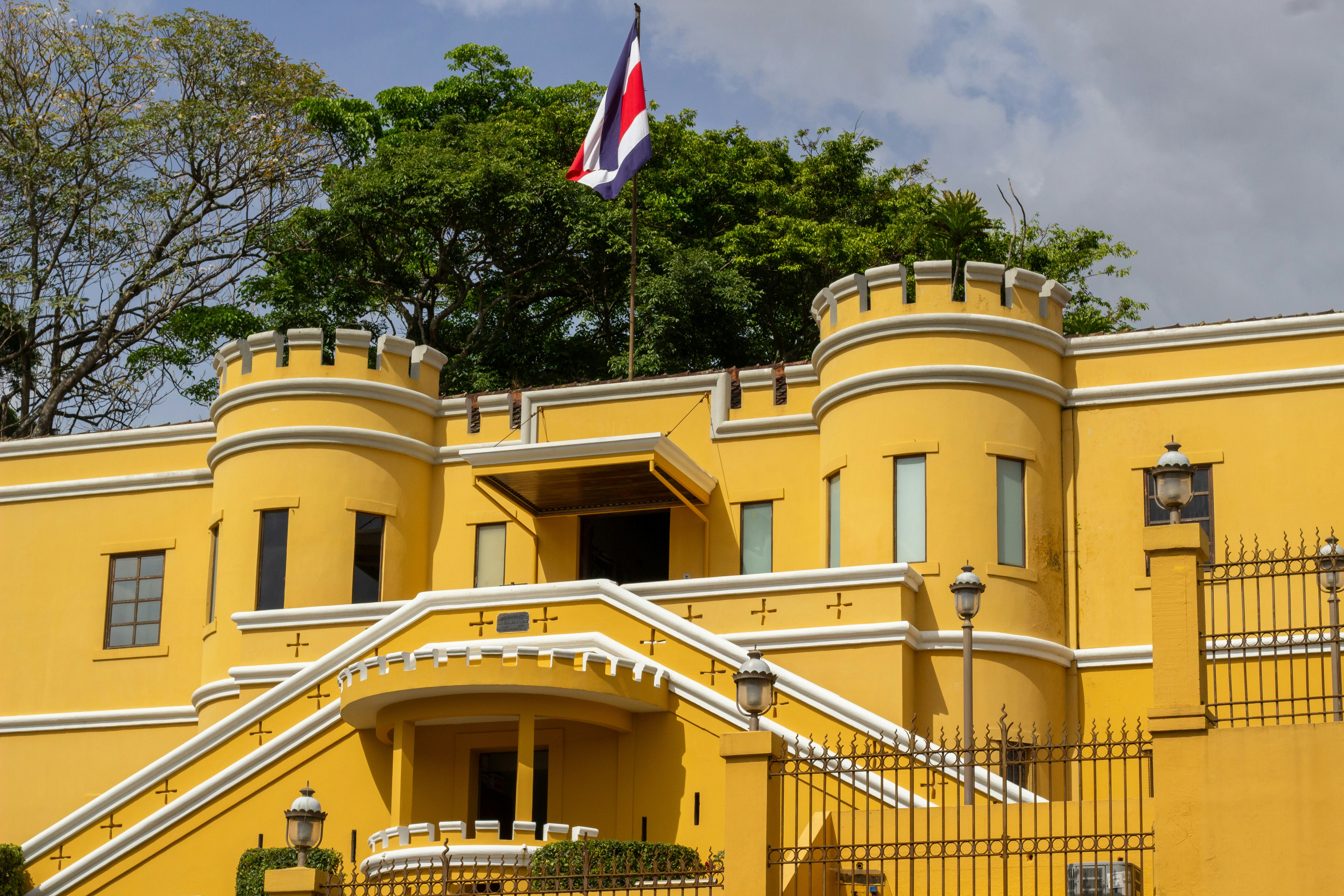 Yellow Fortress: Flag atop a Bright Colonial Building