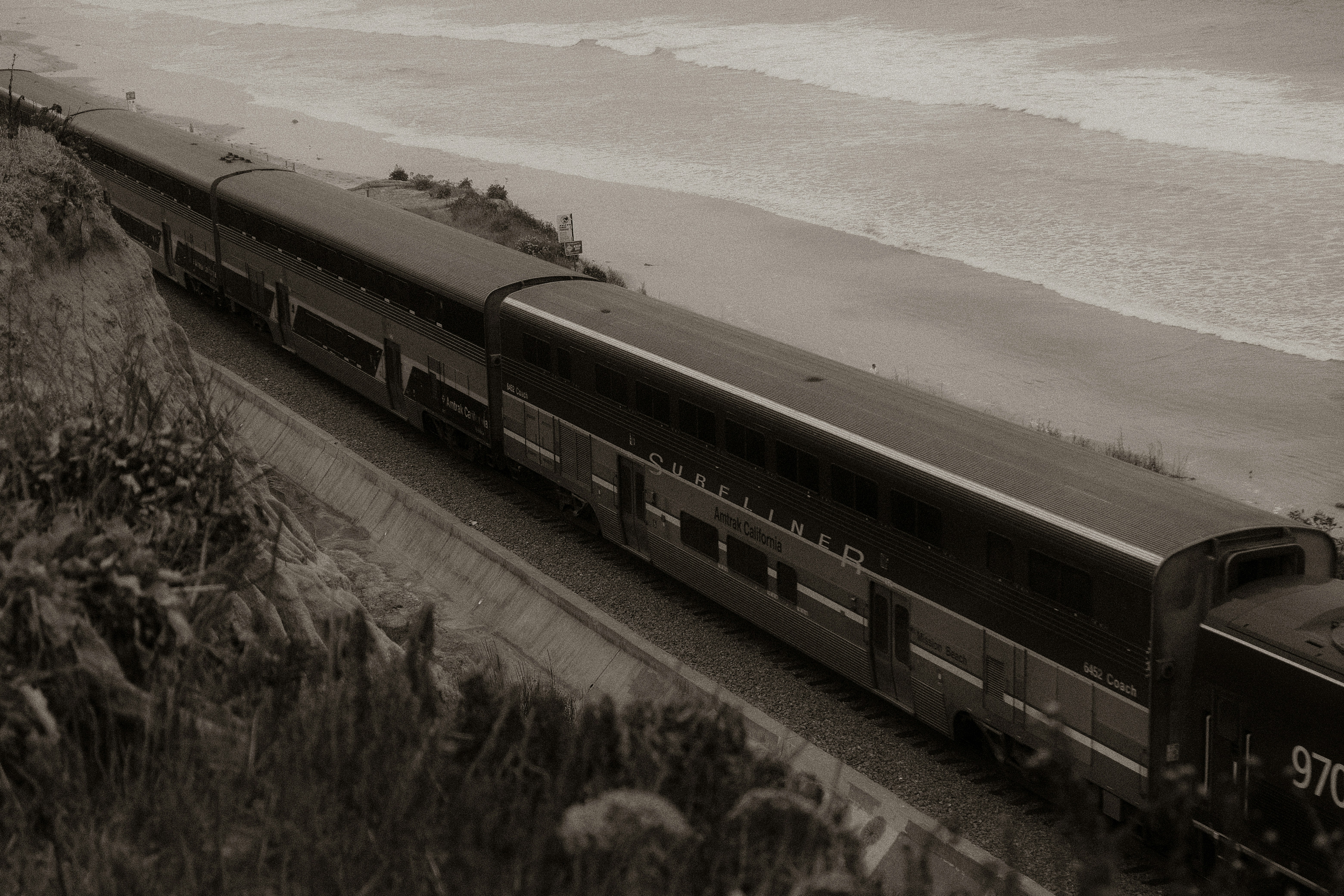 Coastline Voyage: A Kept Silent Train Slices Along the Cliff