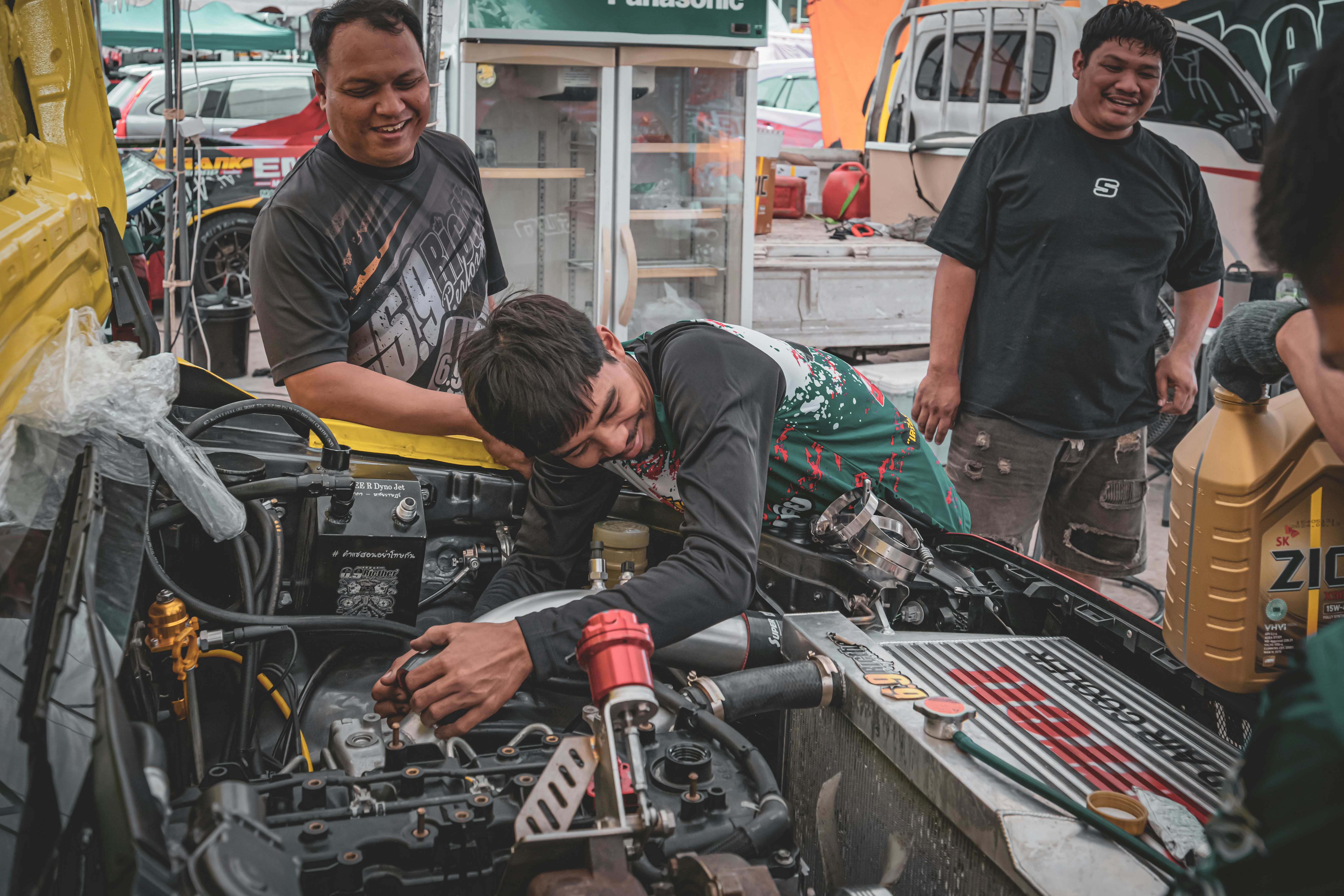 Pit Crew in Action: Gears and Grins under the Hood