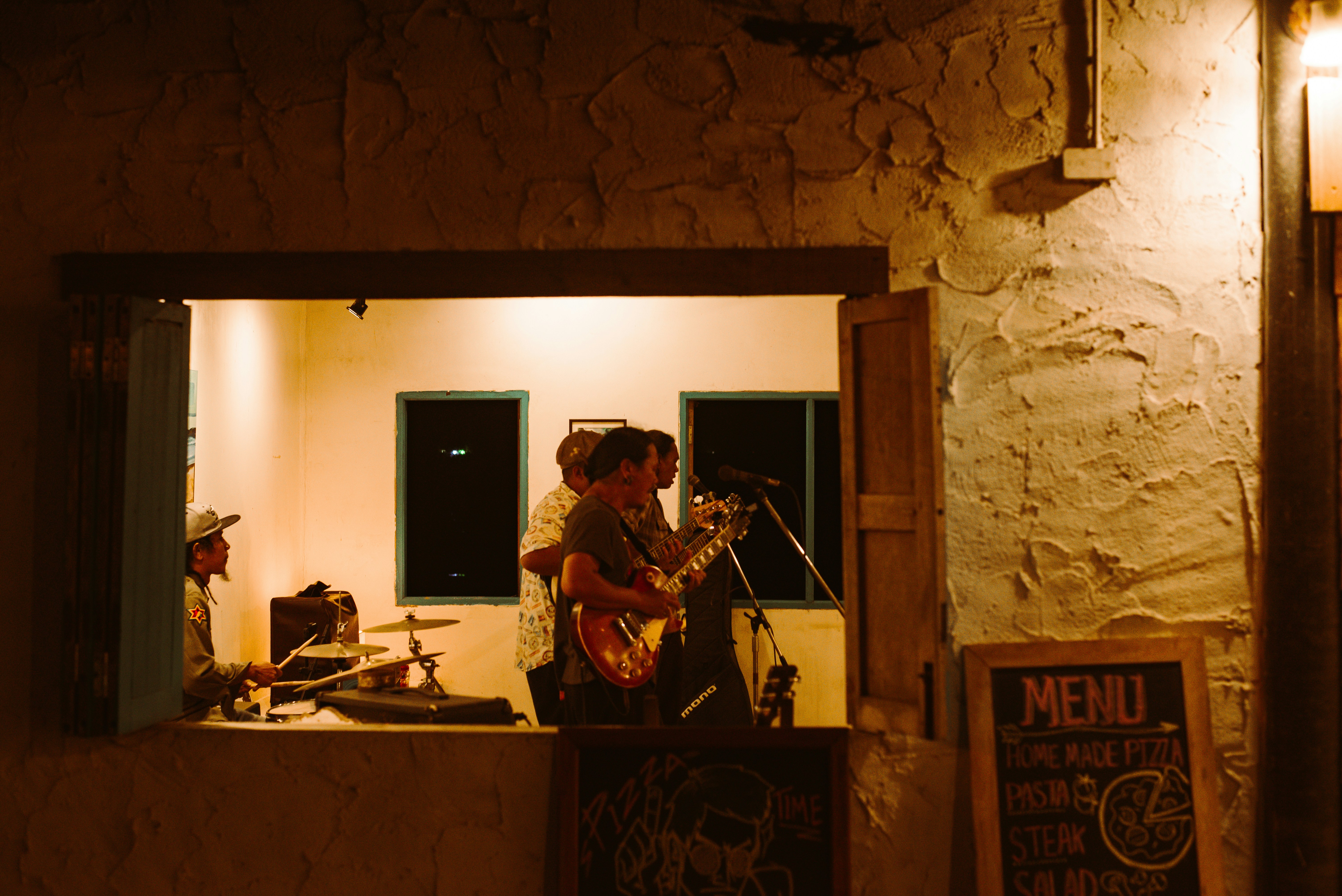 Midnight Jam in the Stone Café: A Trio Echoes Through Warm Darkness