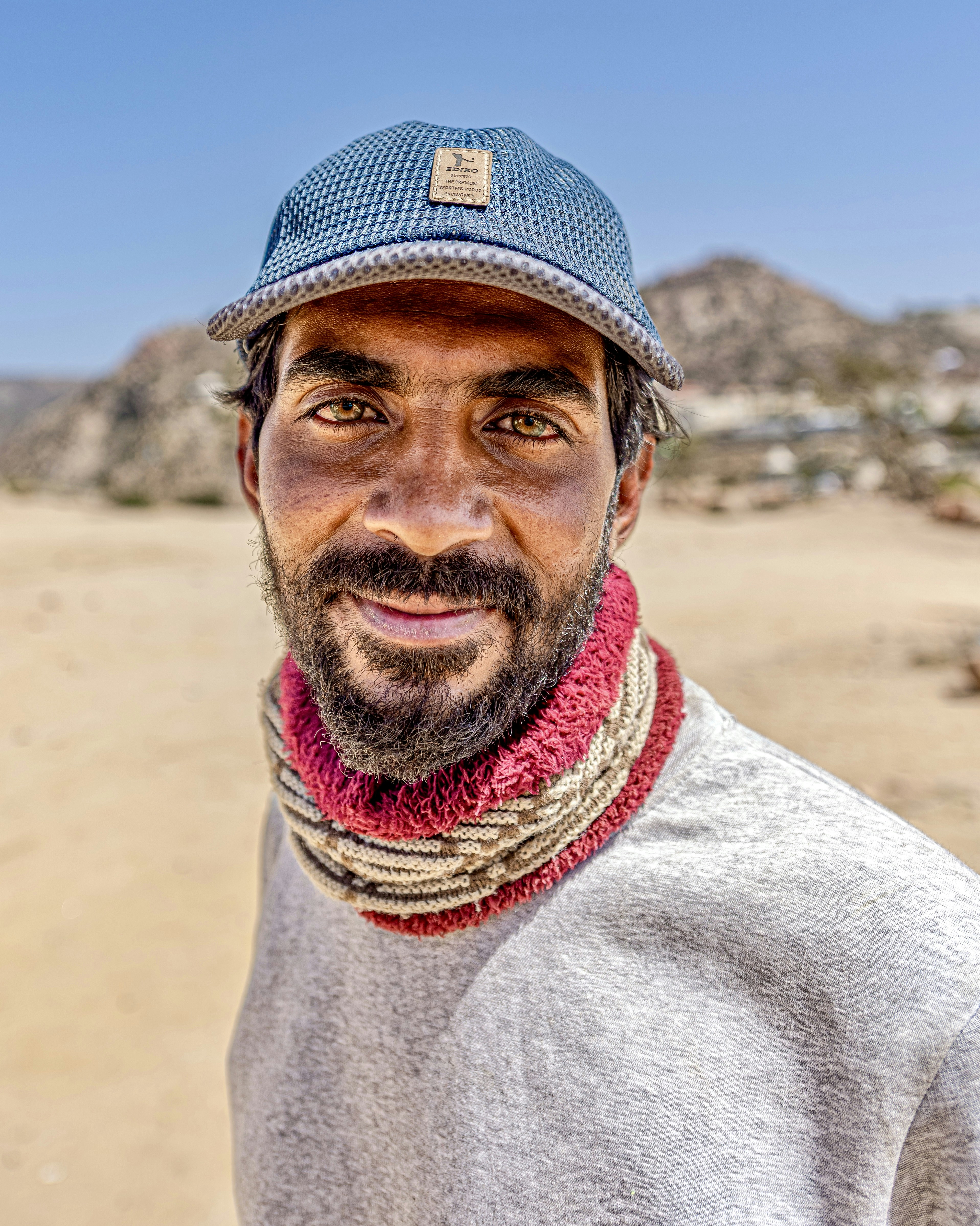 Desert Portrait: A Bearded Traveler Under a Textured Cap