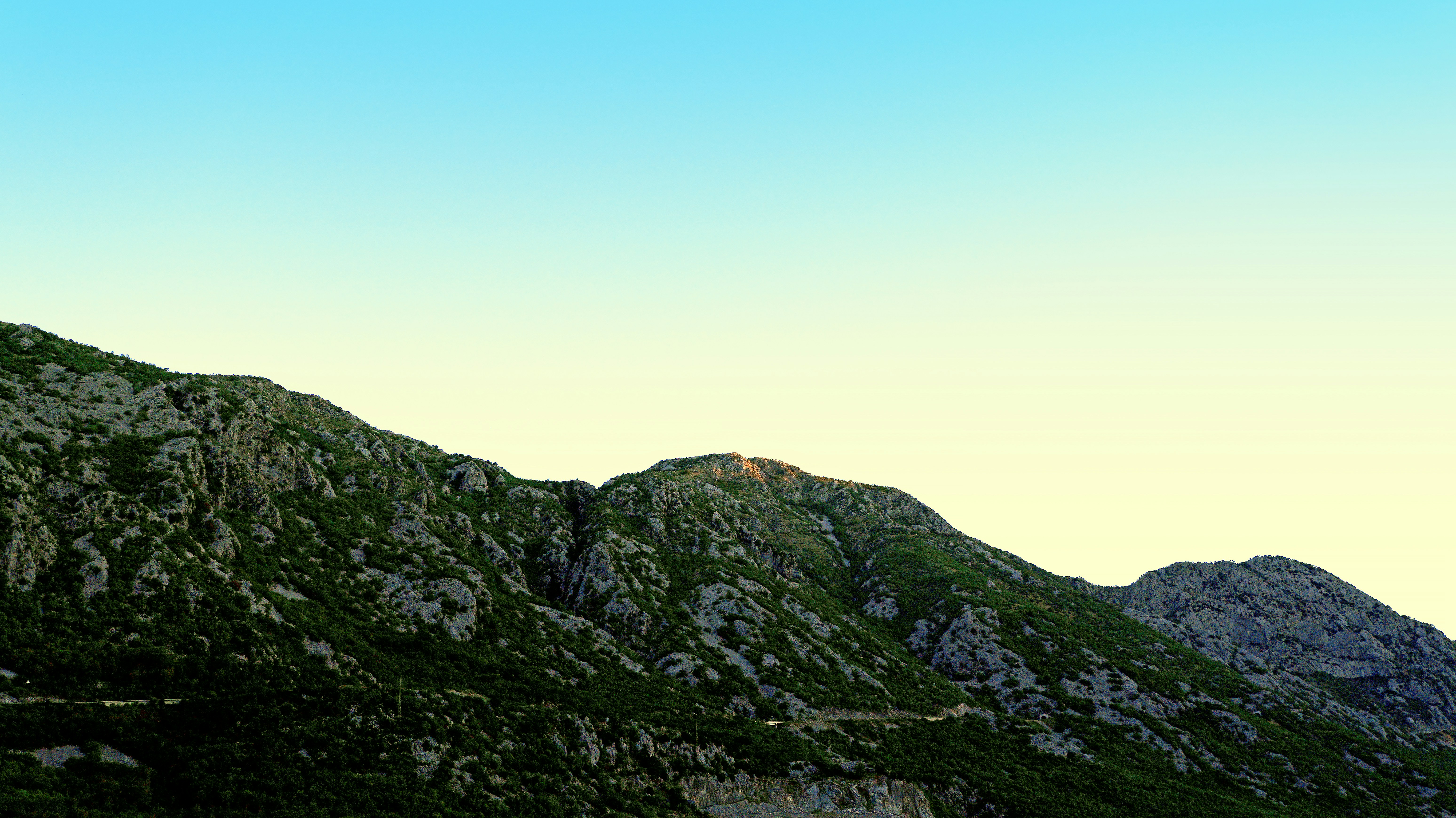 Ridge Line at Golden Hour: A Quiet Terrain Under Clear Sky
