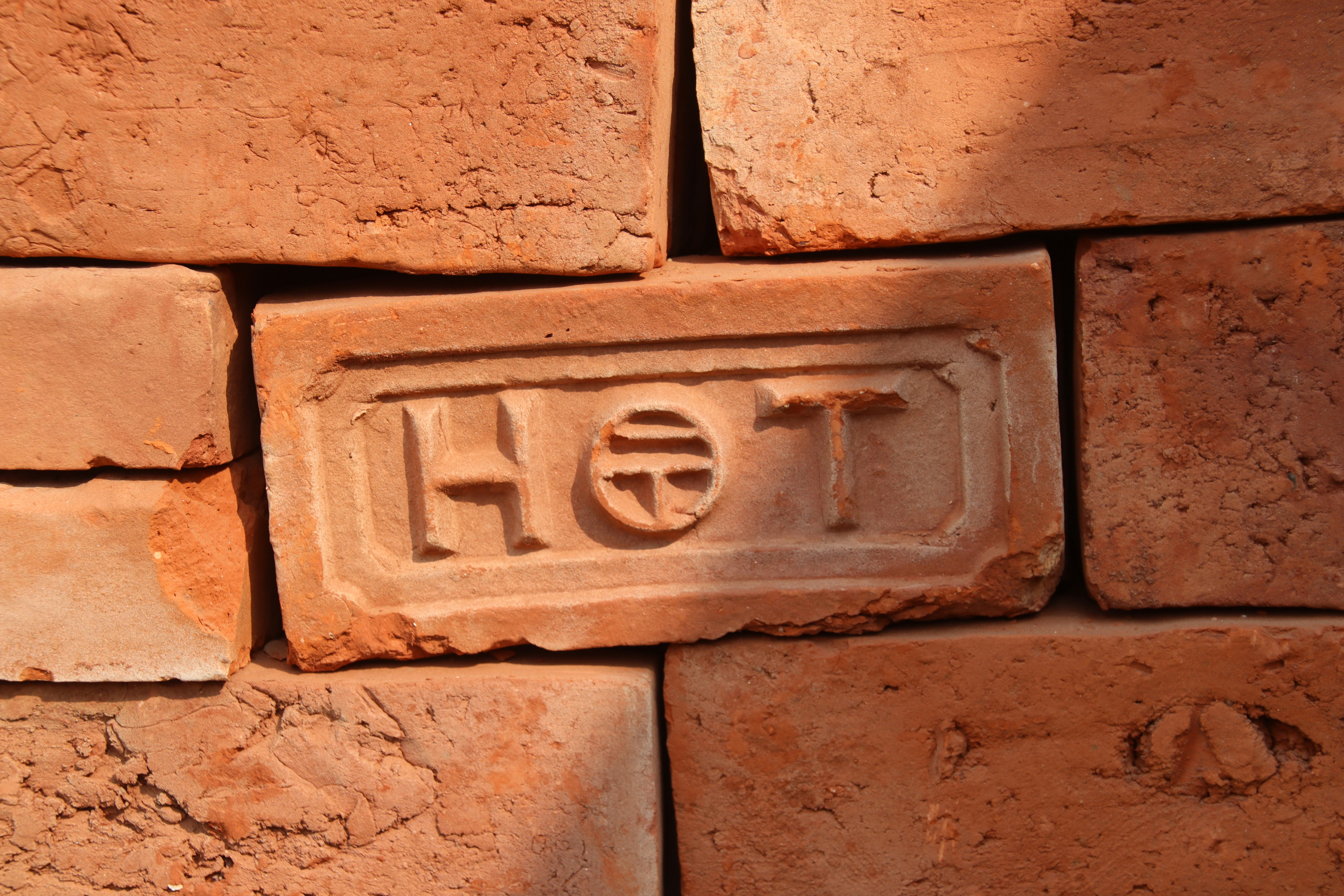 Stamp of Fire: The H OT Brick in a Wall of Dust
