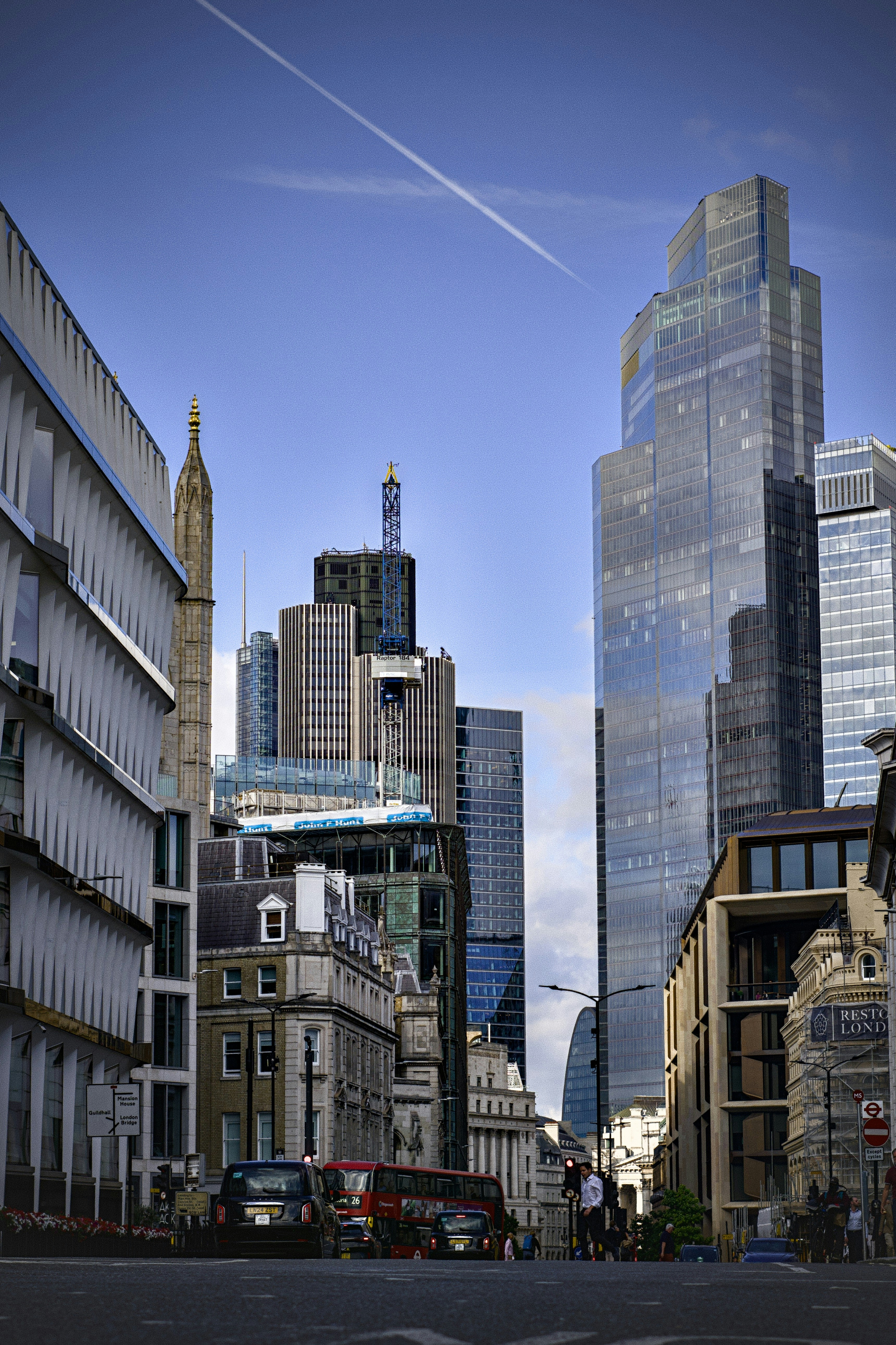 Towering Glass: A Cityscape Soaring Above the Street