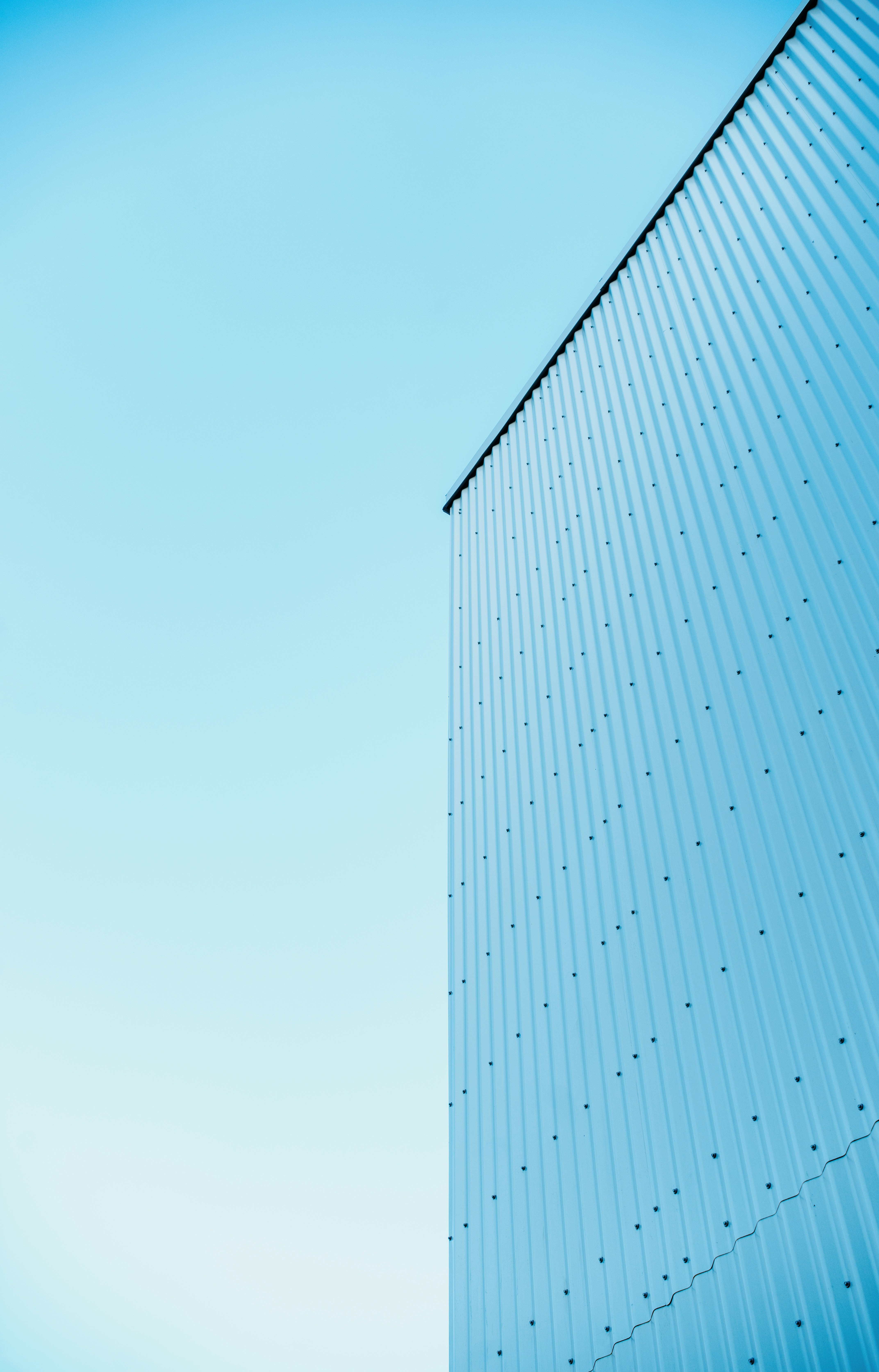 Azure Facade: A Minimal Moment of Geometry Against Sky