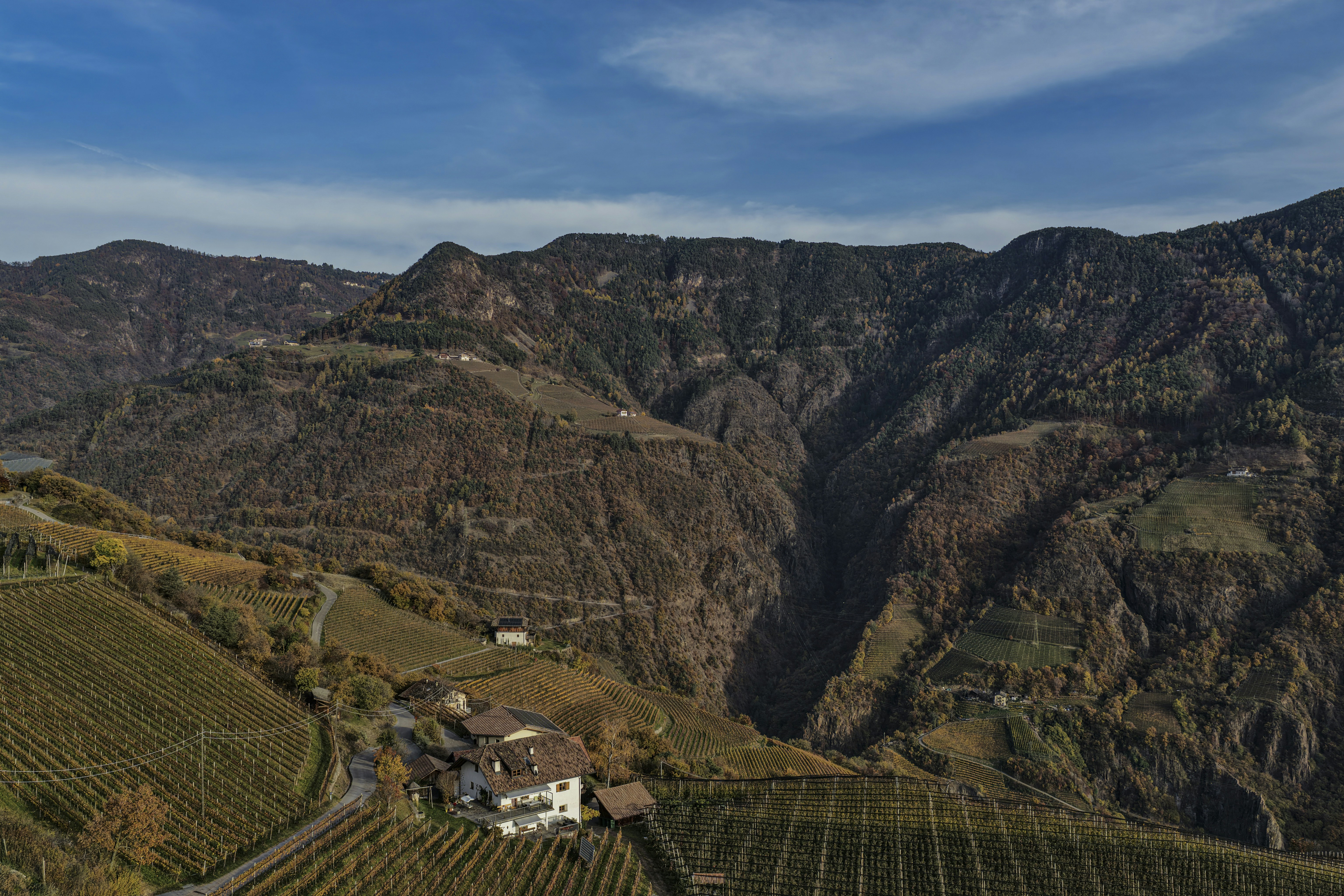 Terraced Valleys under a Clear Alpine Sky