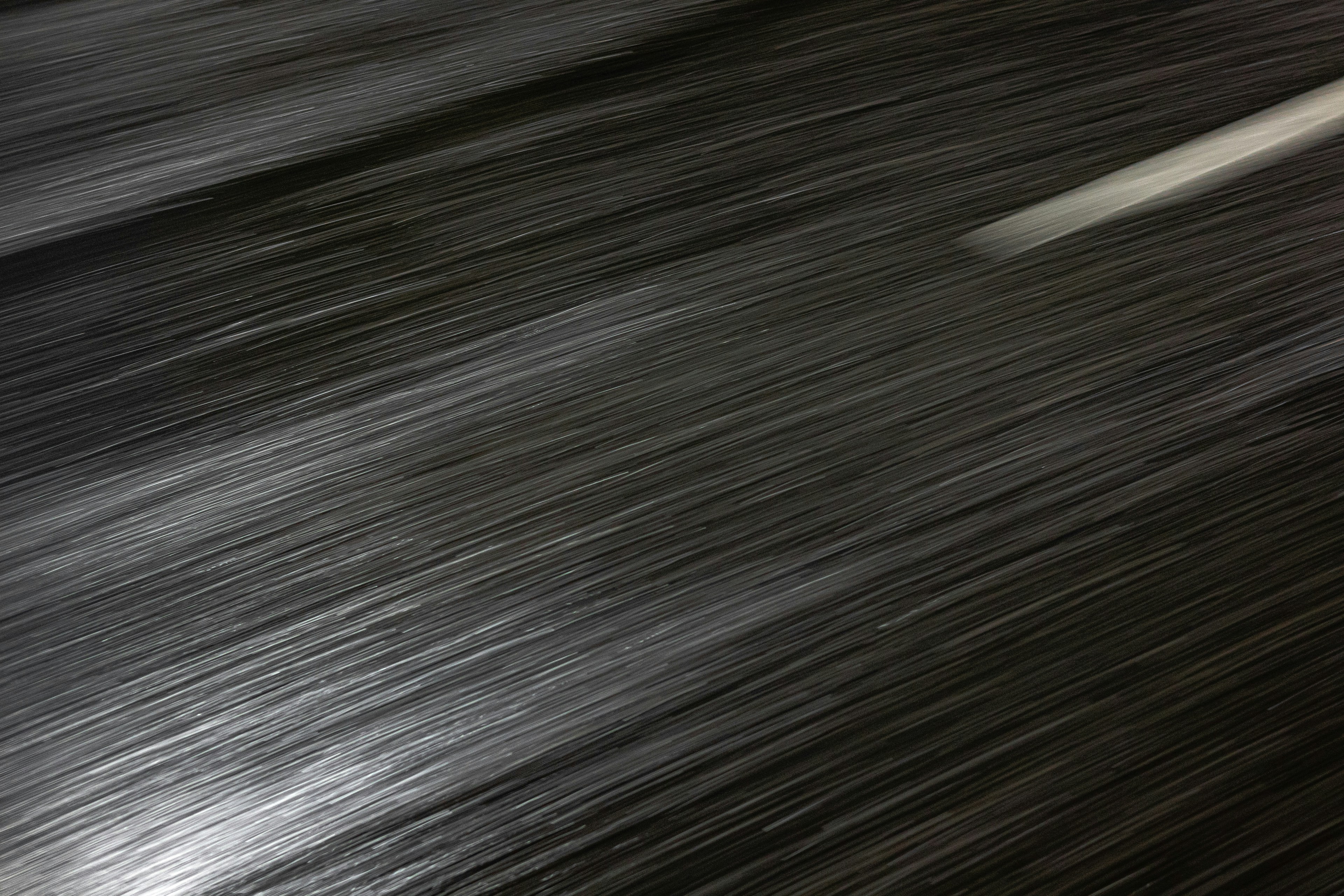 Abstract streaks of light suggest motion and mystery.