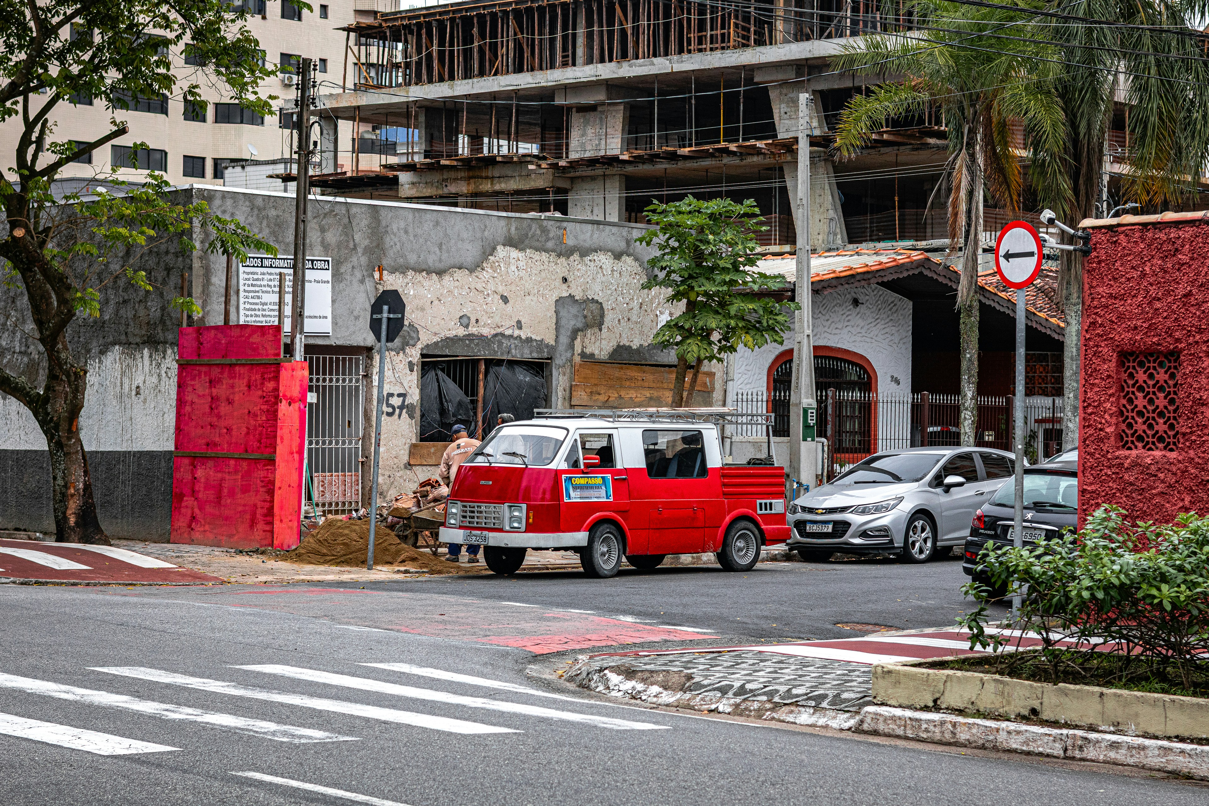 Red Ambulant Flame: A Vintage Van and Street Crossing