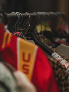 Hanging Threads: A Quiet Rack of Colorful Garments