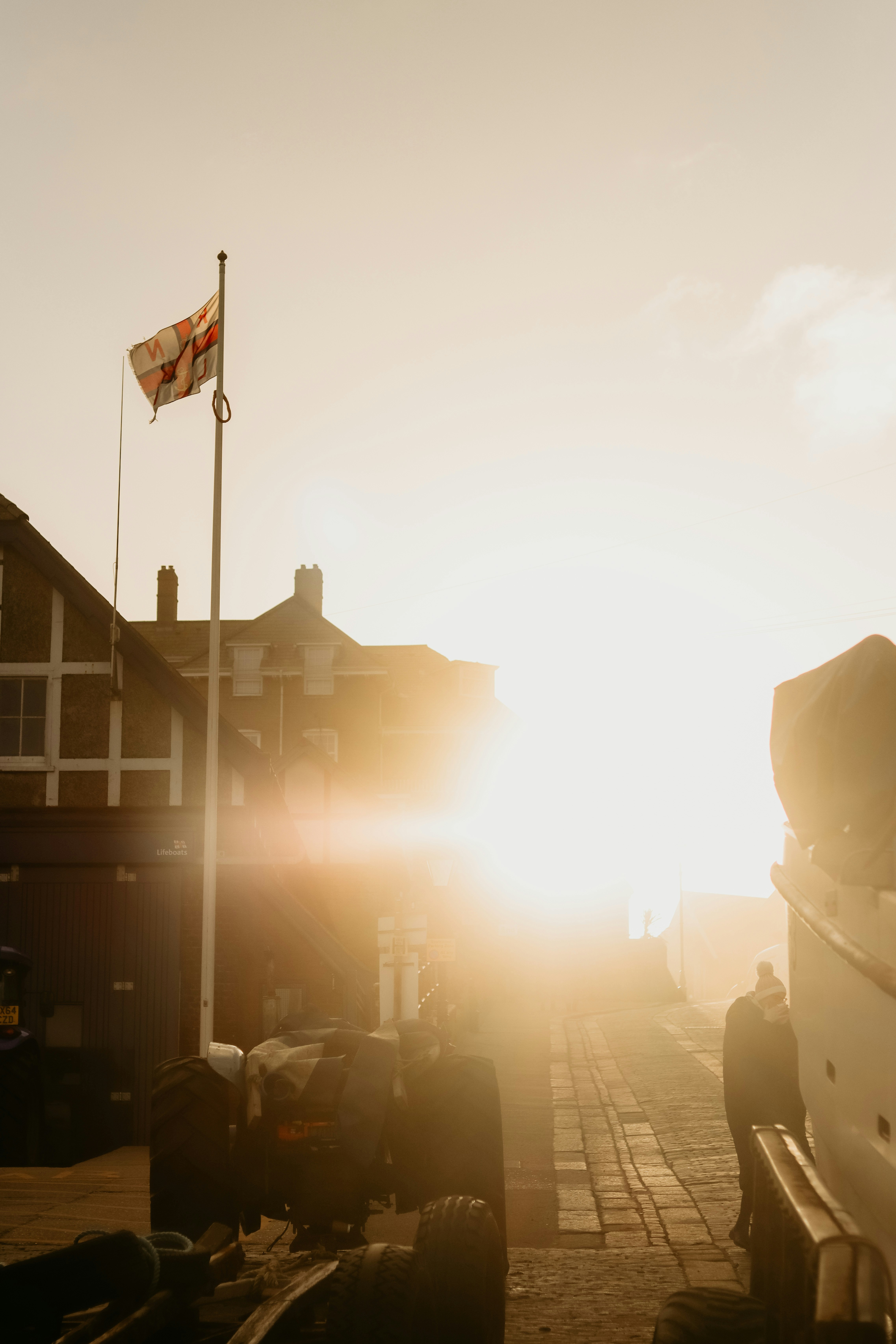 Sunlit Wharf: A Tide of Light Over a Quiet Harbor