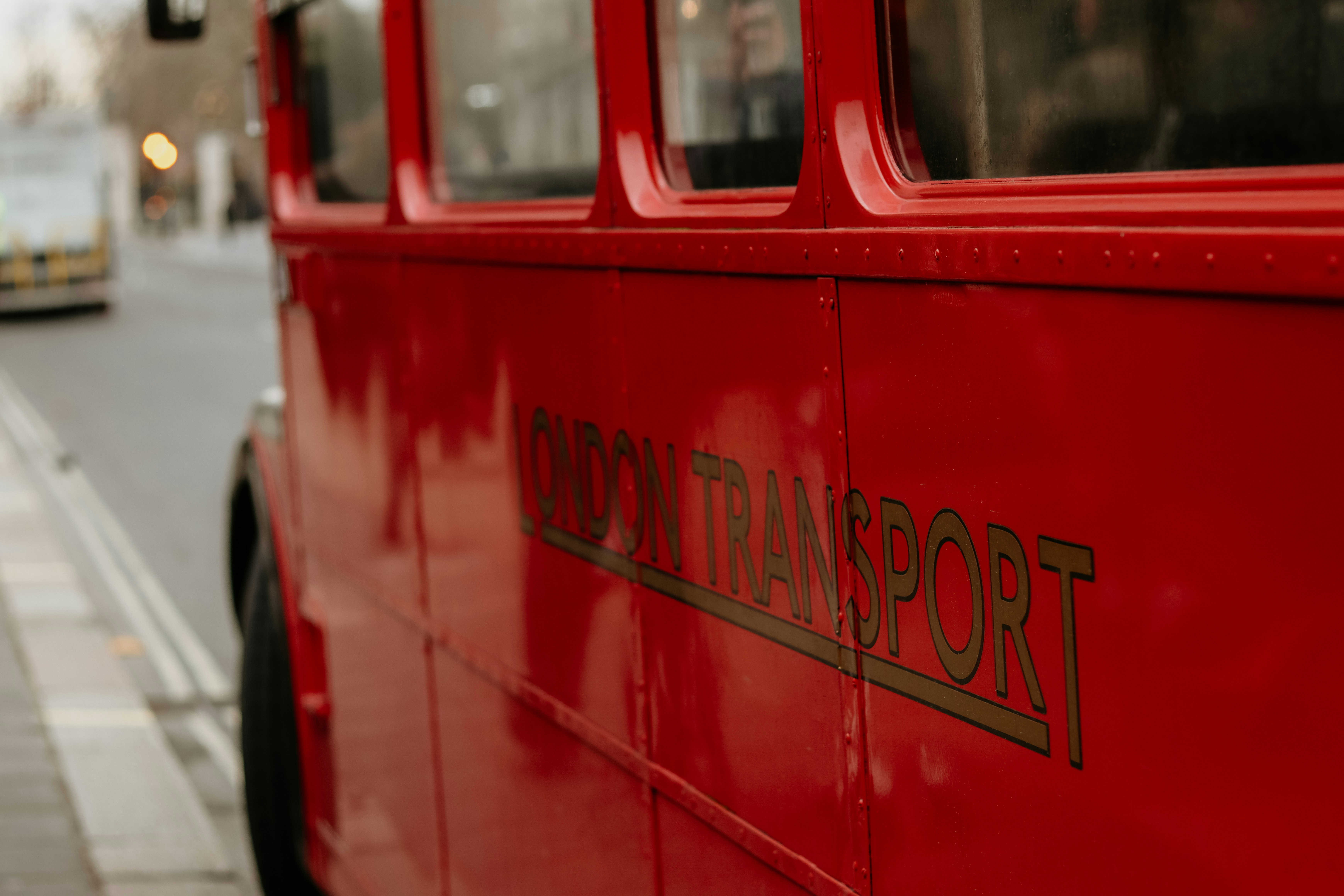 Brick-Red Riverside: A Tram’s Quiet Gaze Down the Lane