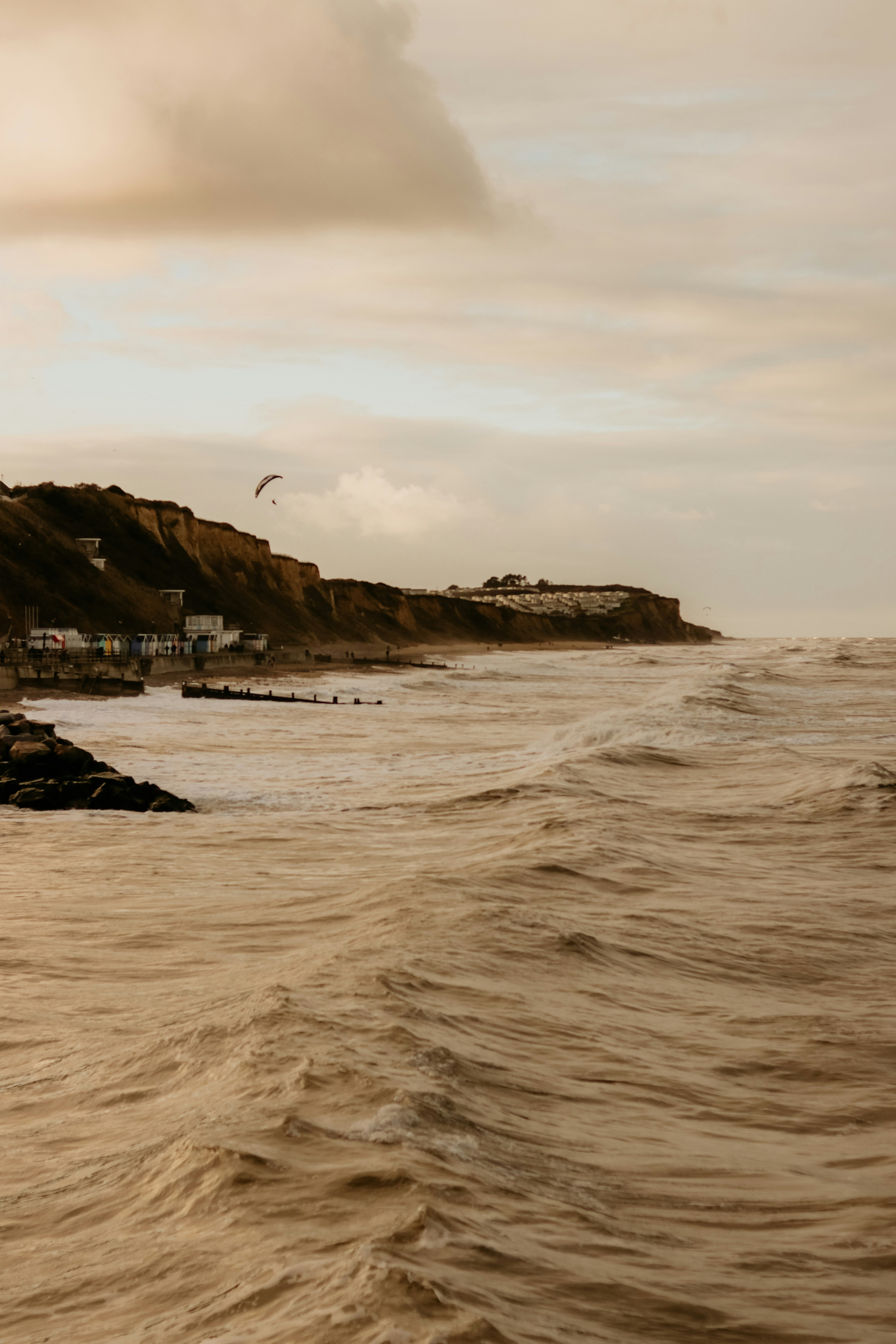 Coastal Cliffline at Dusk with Cresting Waves