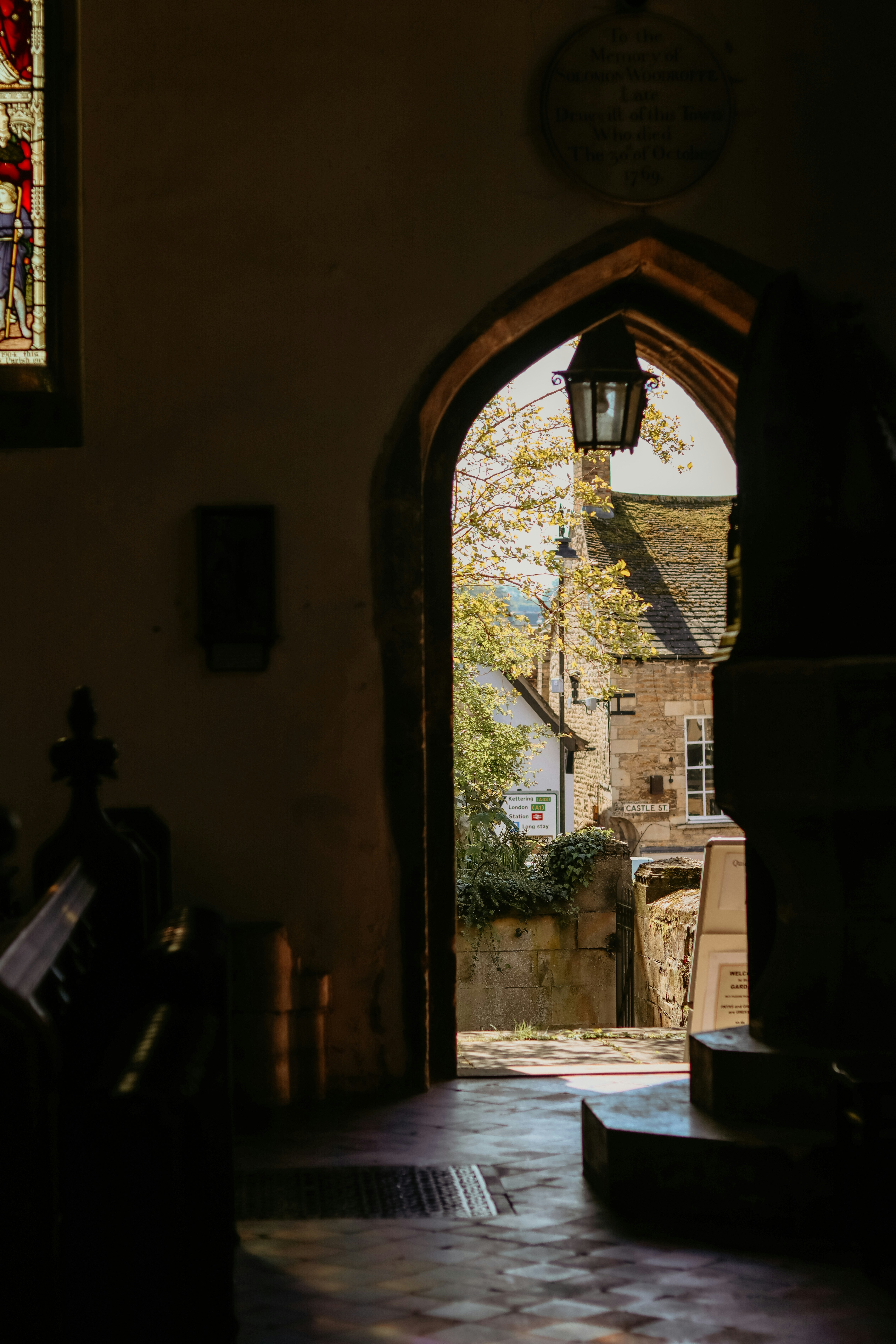 Light at the Arch: Quiet Exterior Through A Dark Chapel