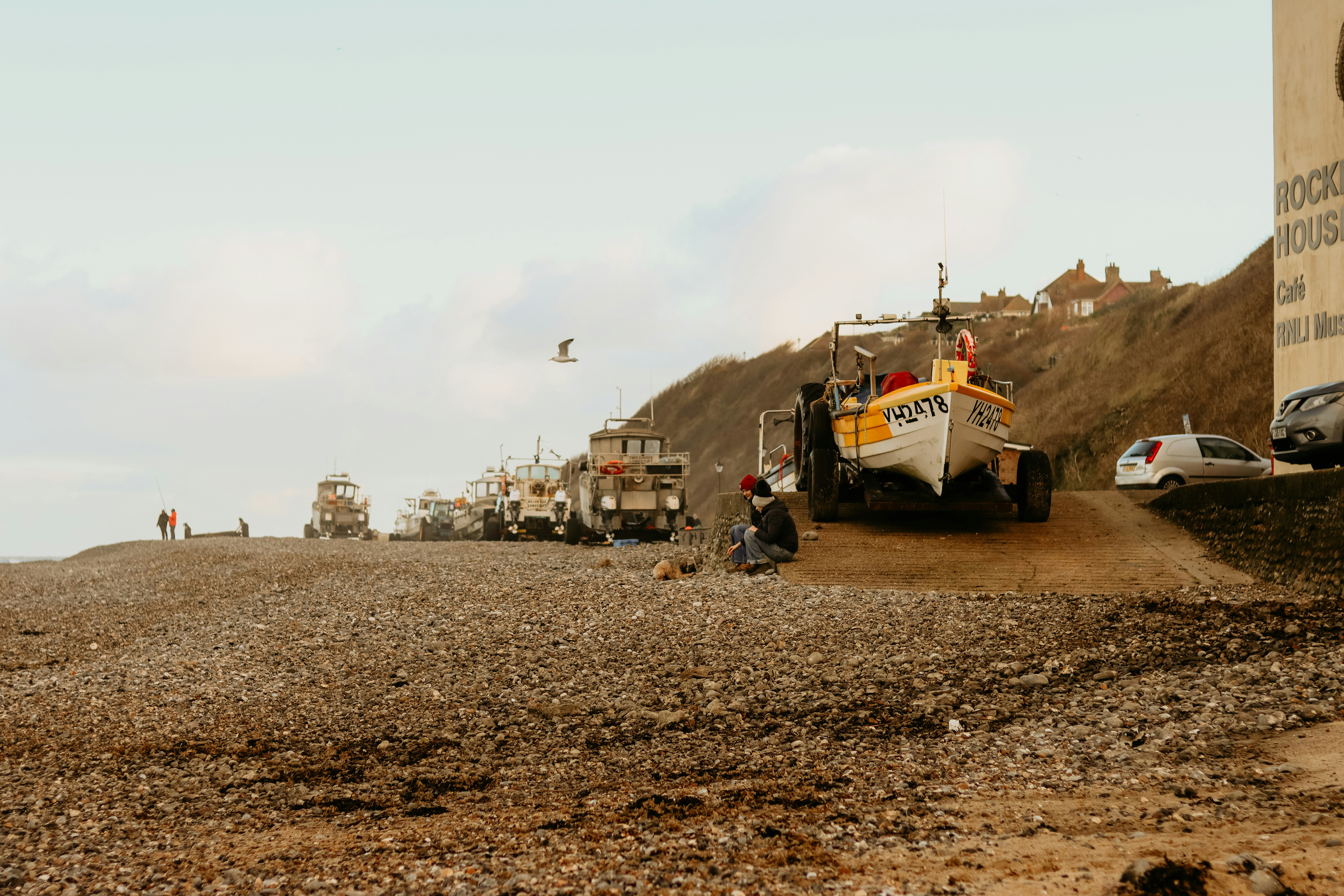 Harbor of Hastings: Boats, Pebble Beach, and a Quiet Assembly