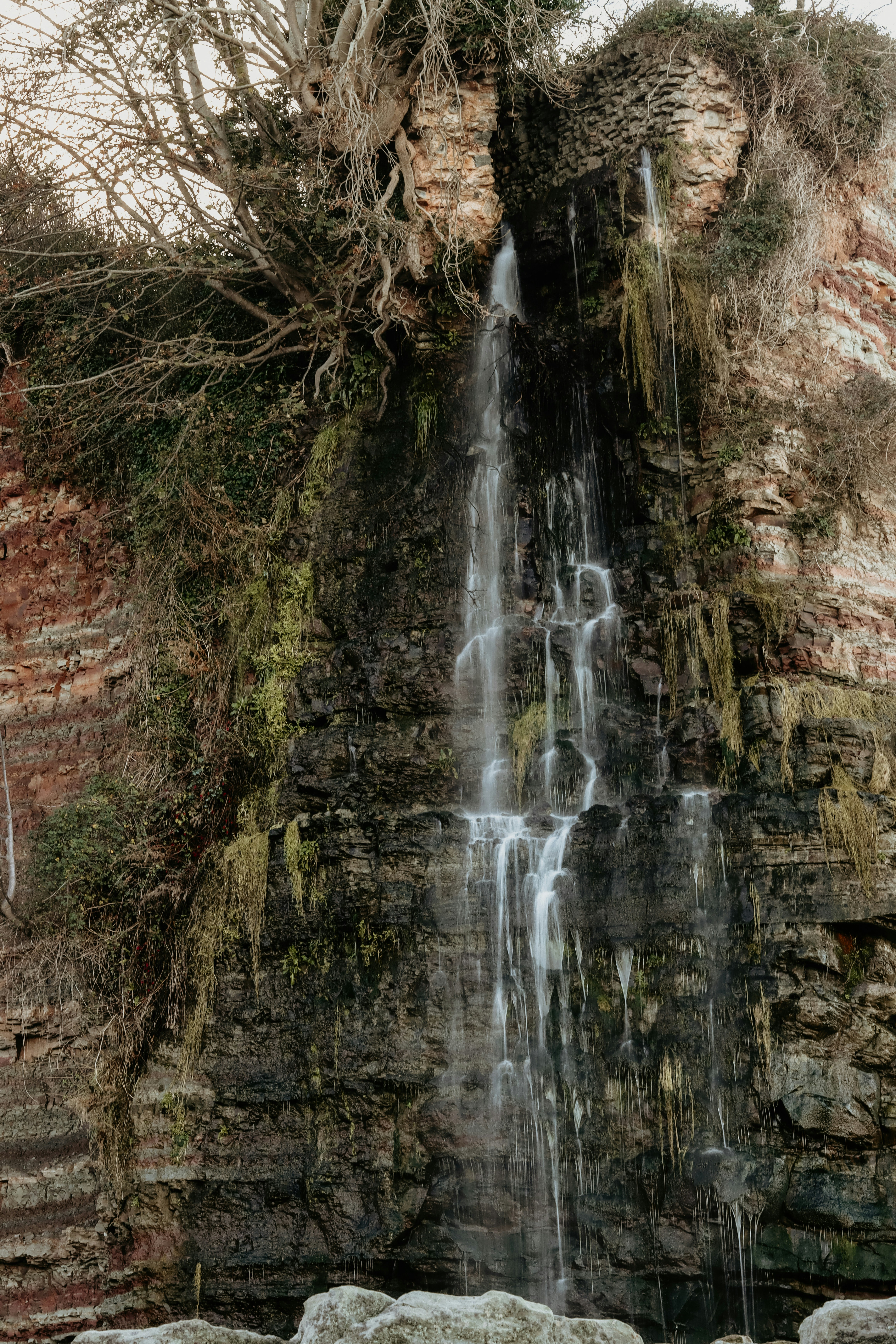 Waterfall Veil on a Rugged Cinder Cliff
