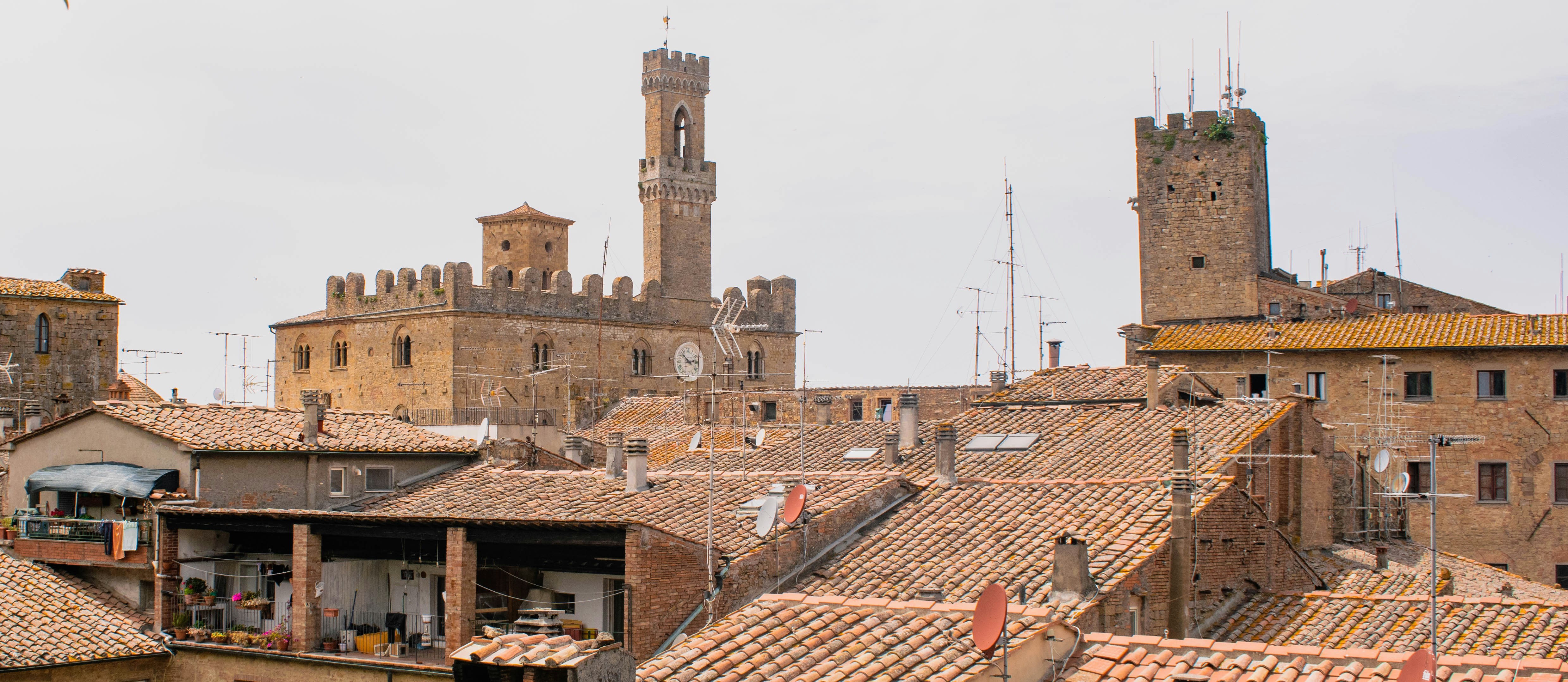 Terracotta Sea: Rooftop Village under a Soft Italian Sky