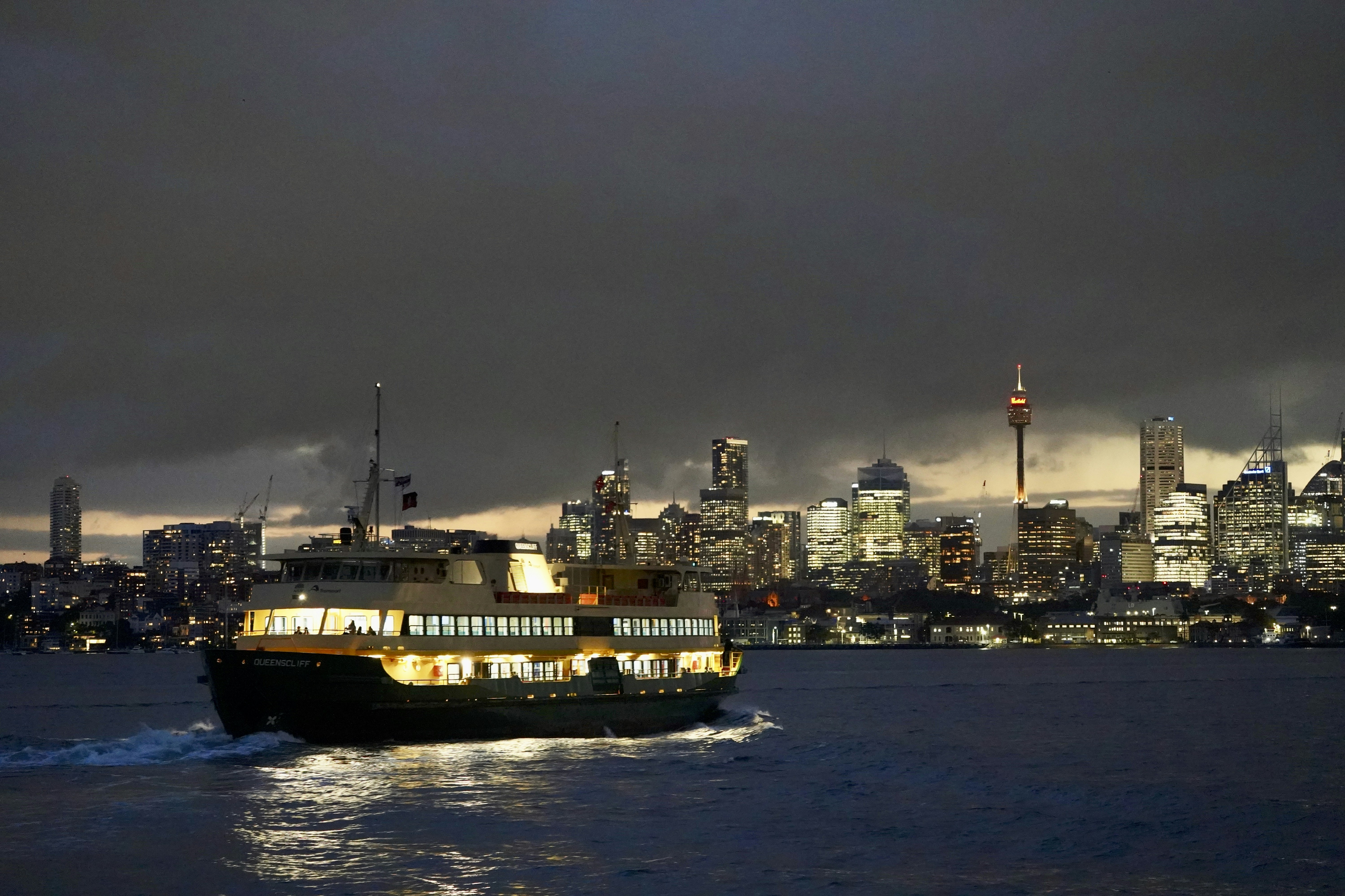 City Lights Afloat: Night Ferry Across a Shimmering Harbor