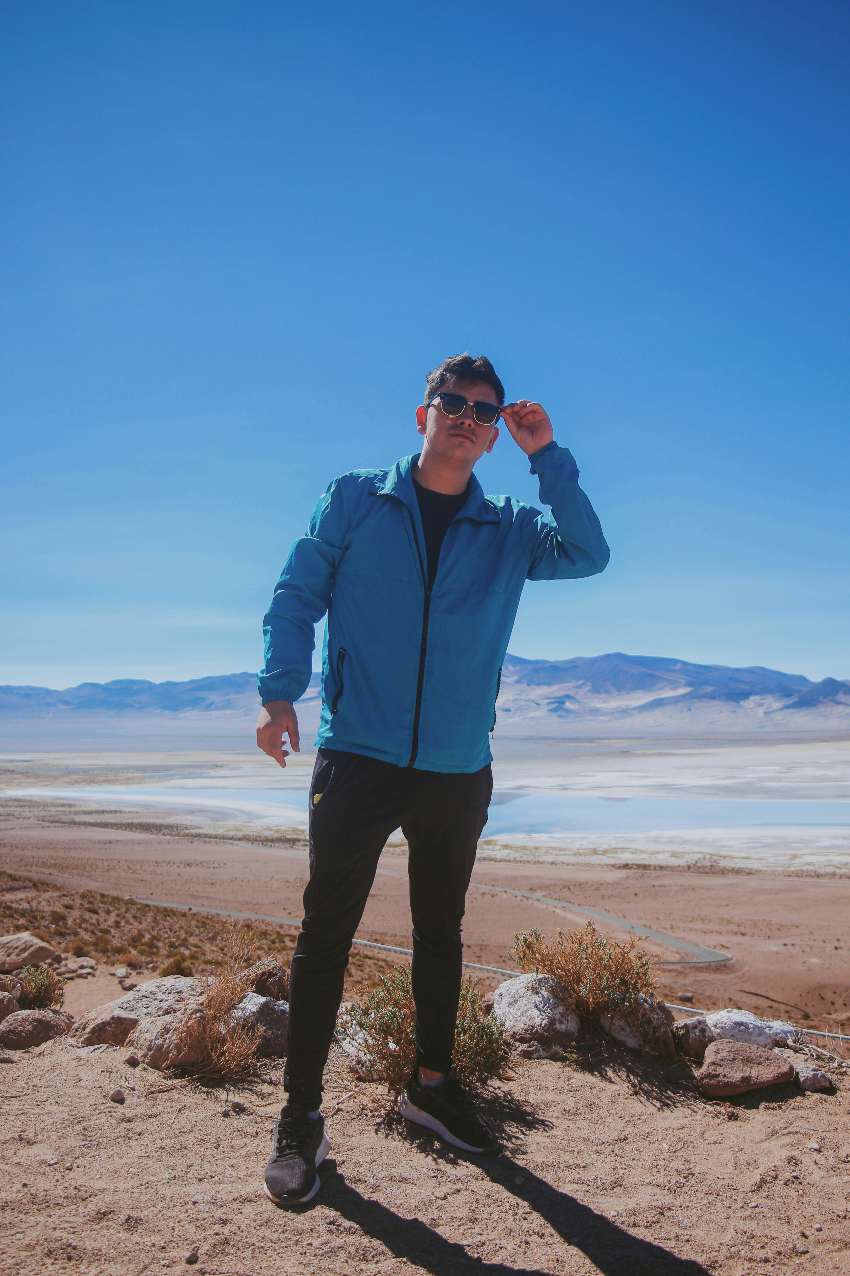 Shade of Blue: Portrait Against a Desert Panorama