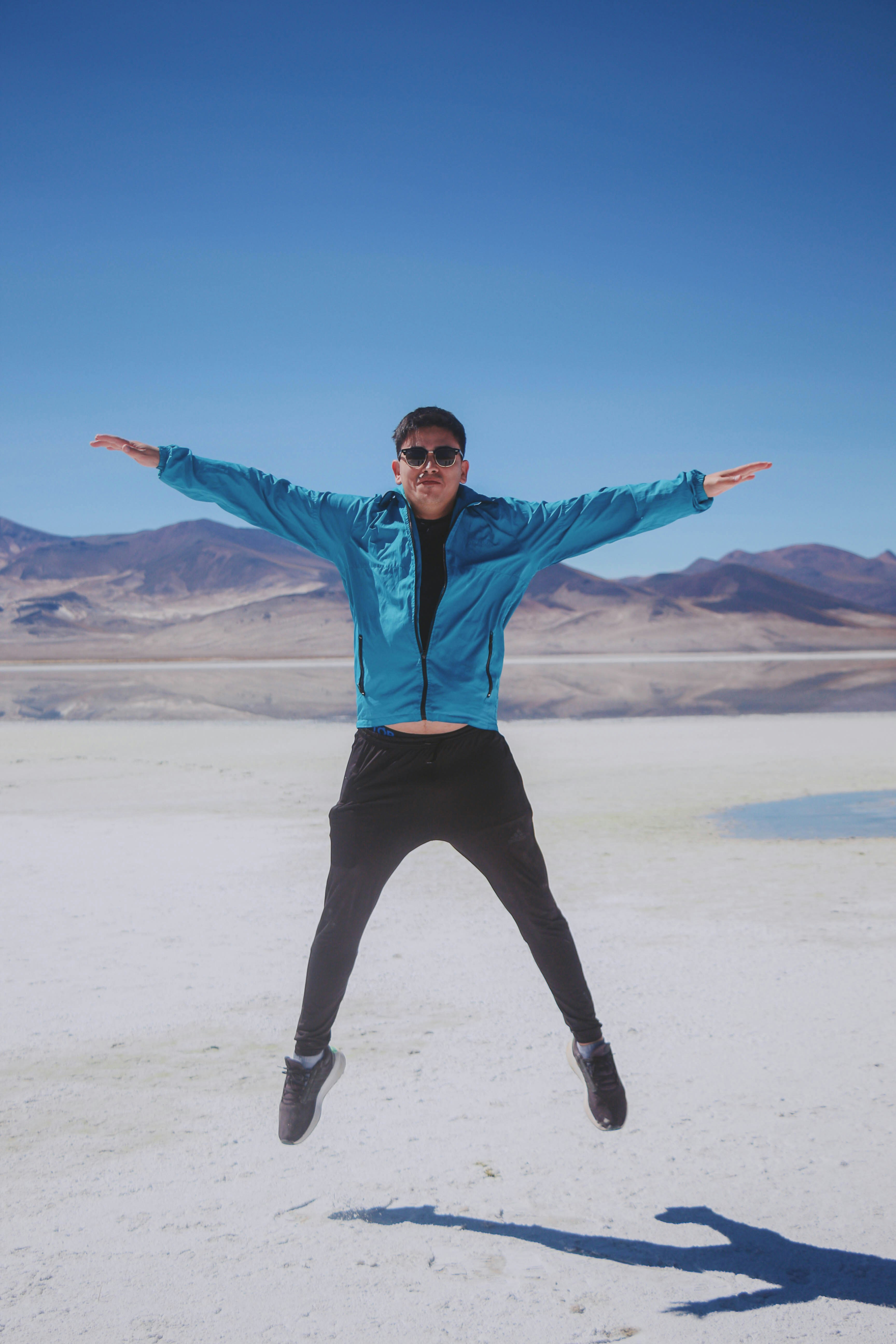 Leap Across the Salt-Flat: A Splash of Sky and Blue